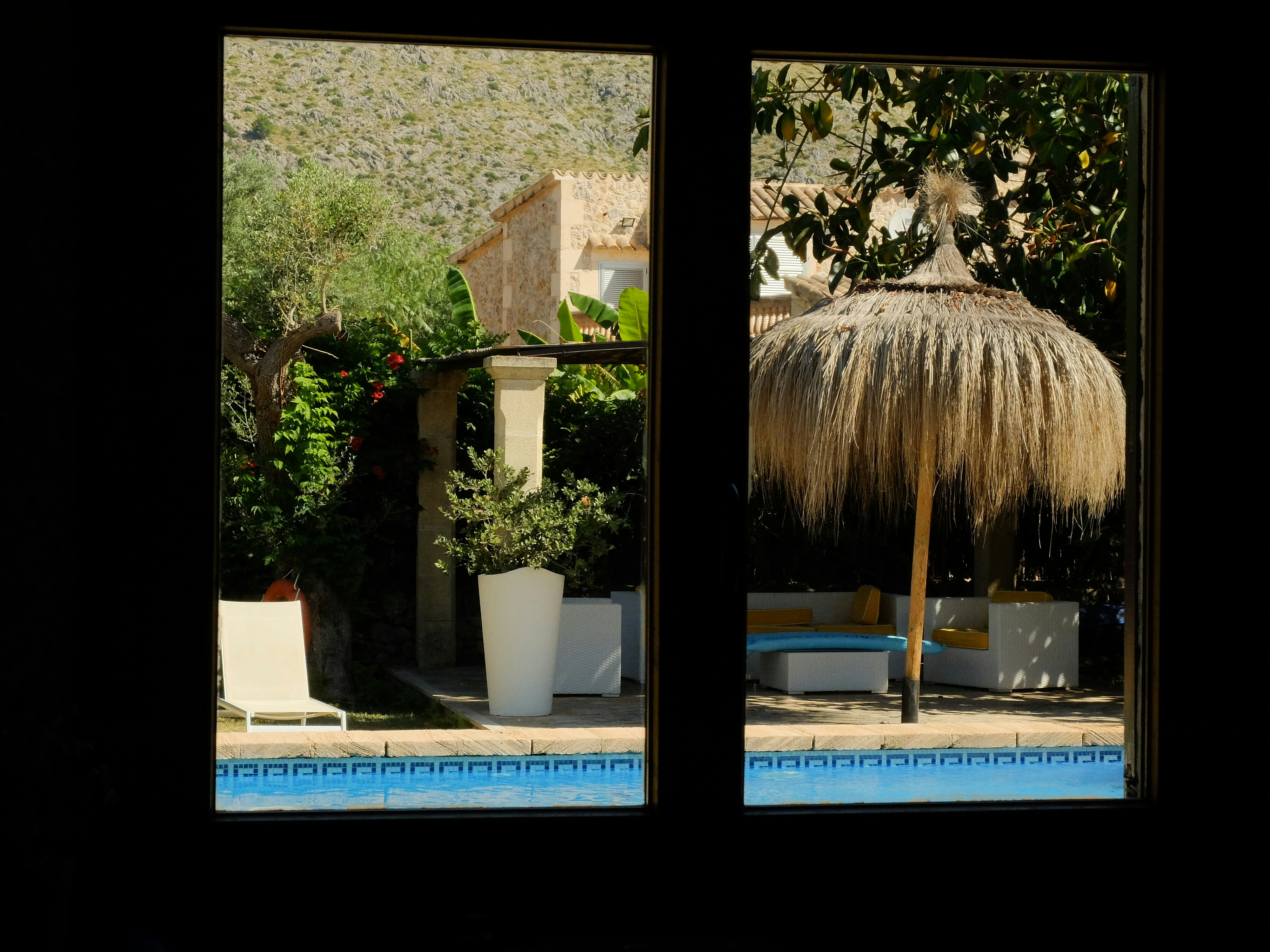 Through the Window to a Poolside Oasis