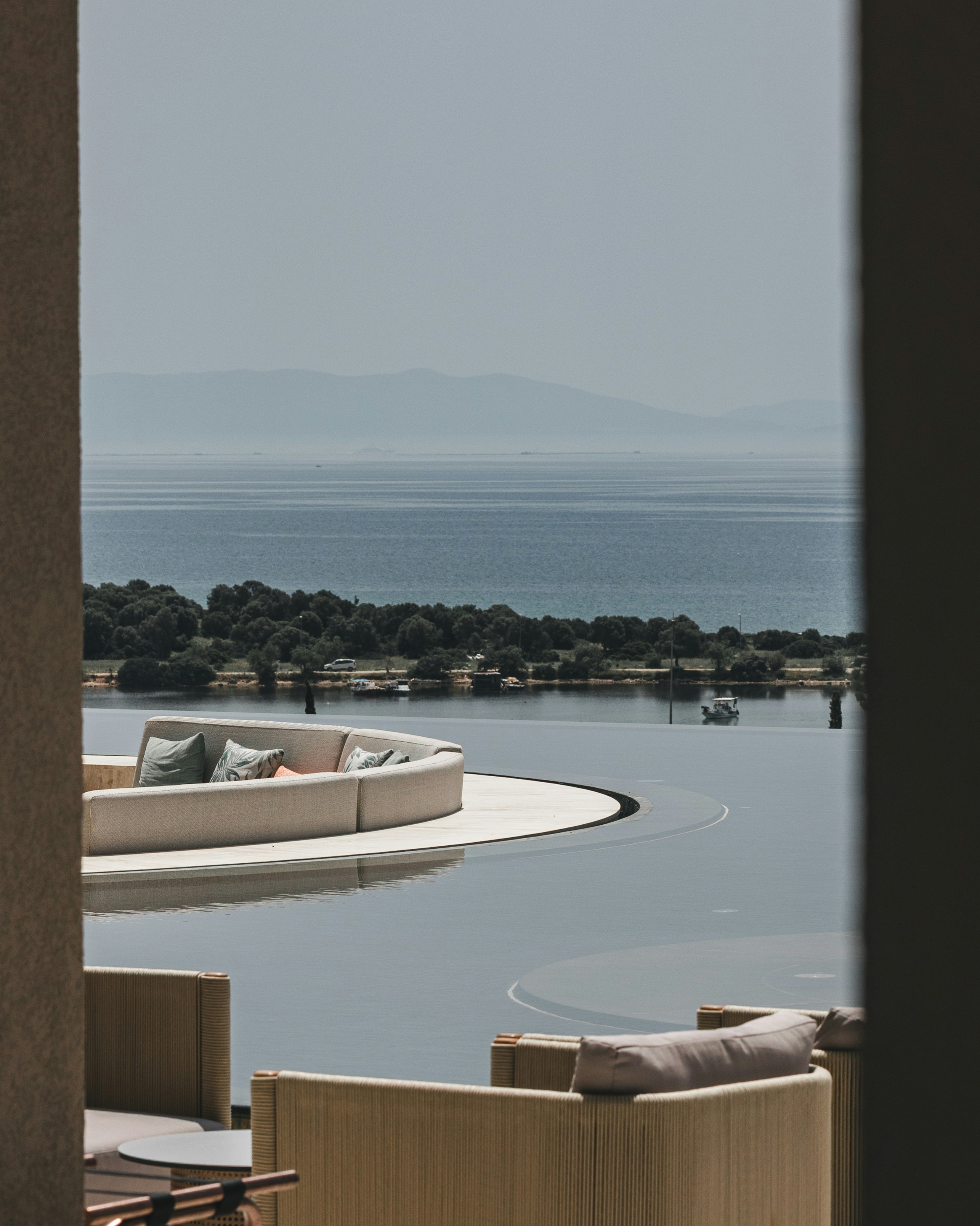 Circular Lounge on Still Water: A Private Shoreline View