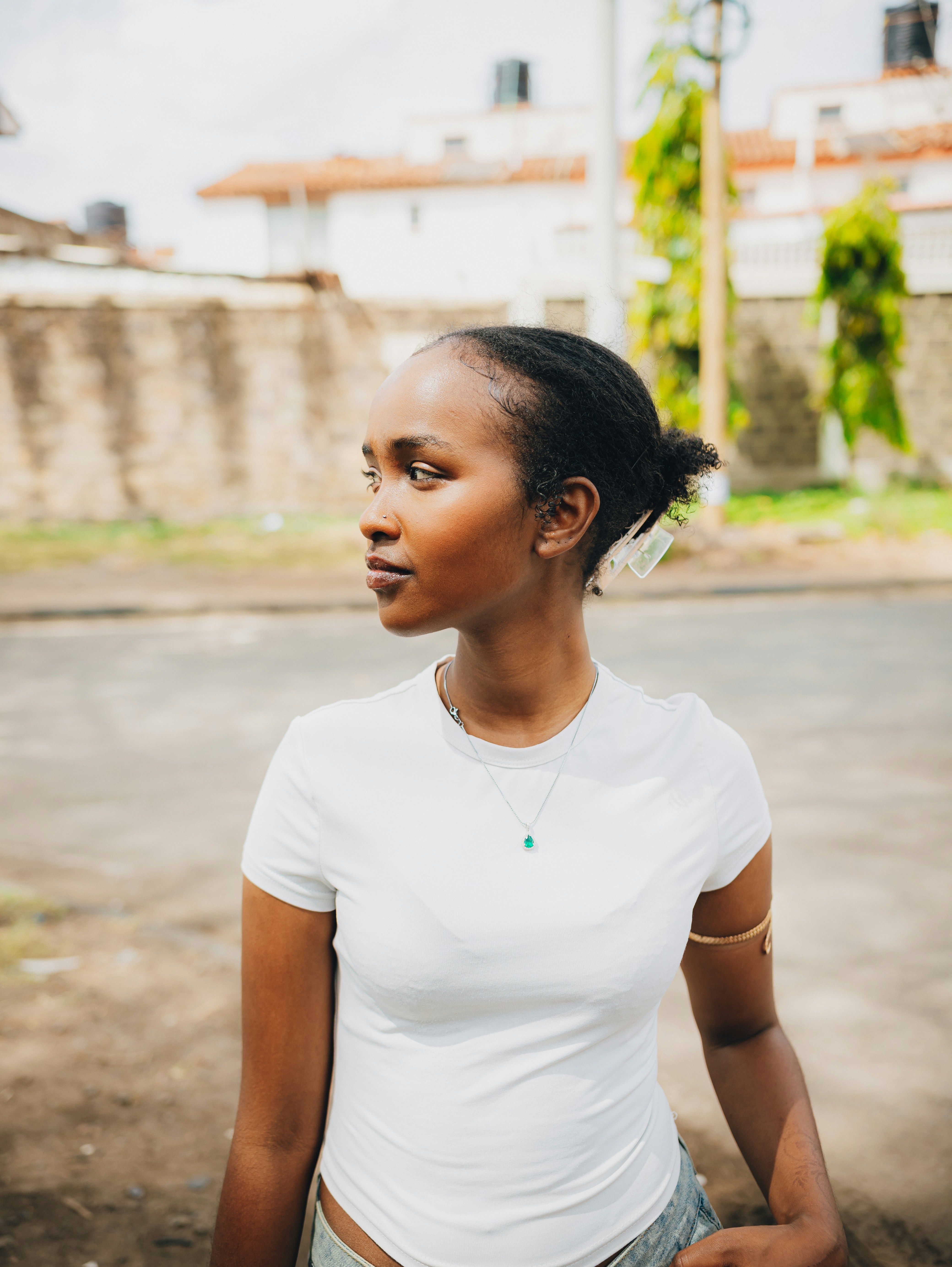 Portrait in Warm Street Light: A Quiet Moment in White Tee