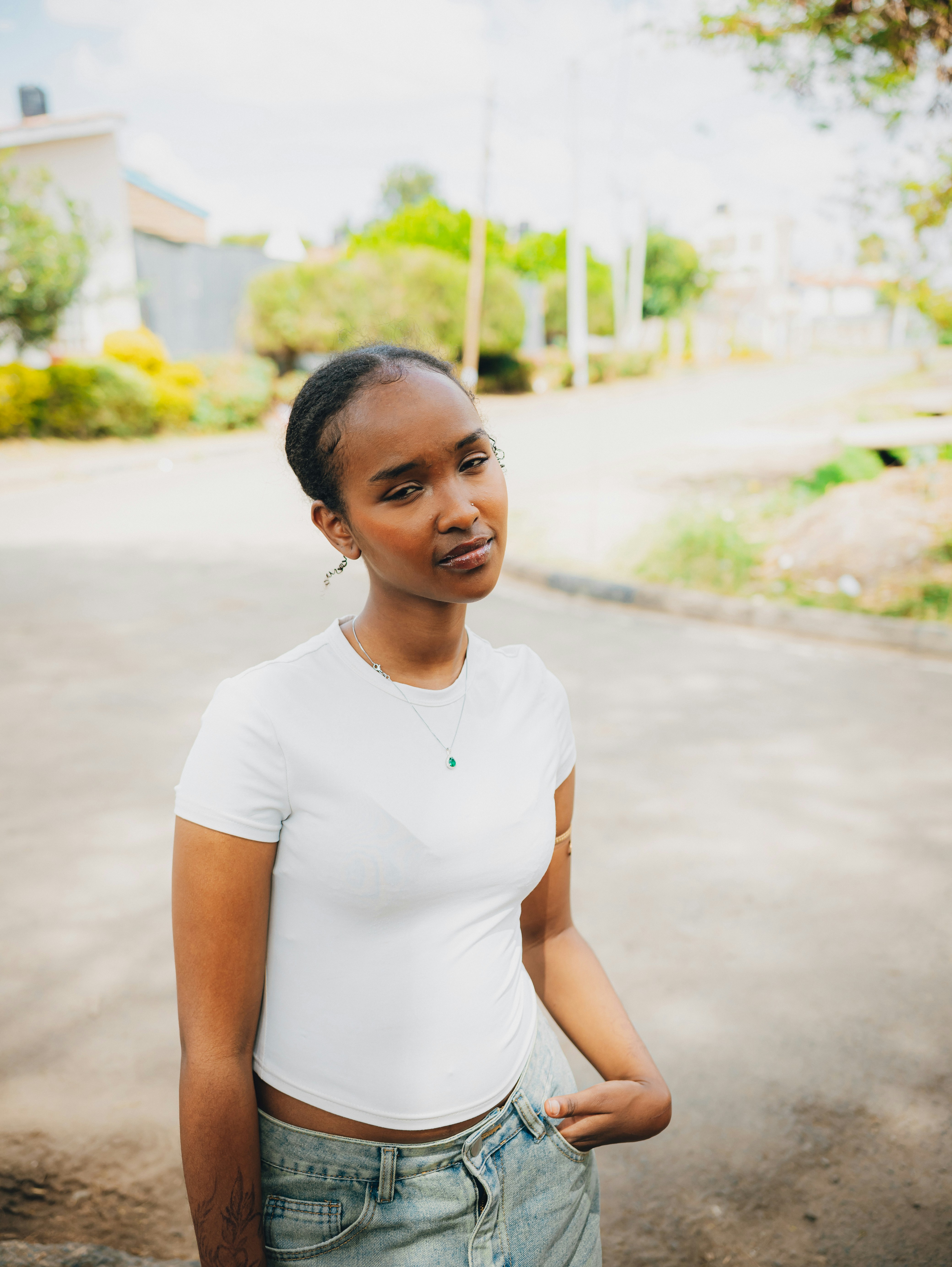 Quiet Confidence in White: A Portrait on the Quiet Street
