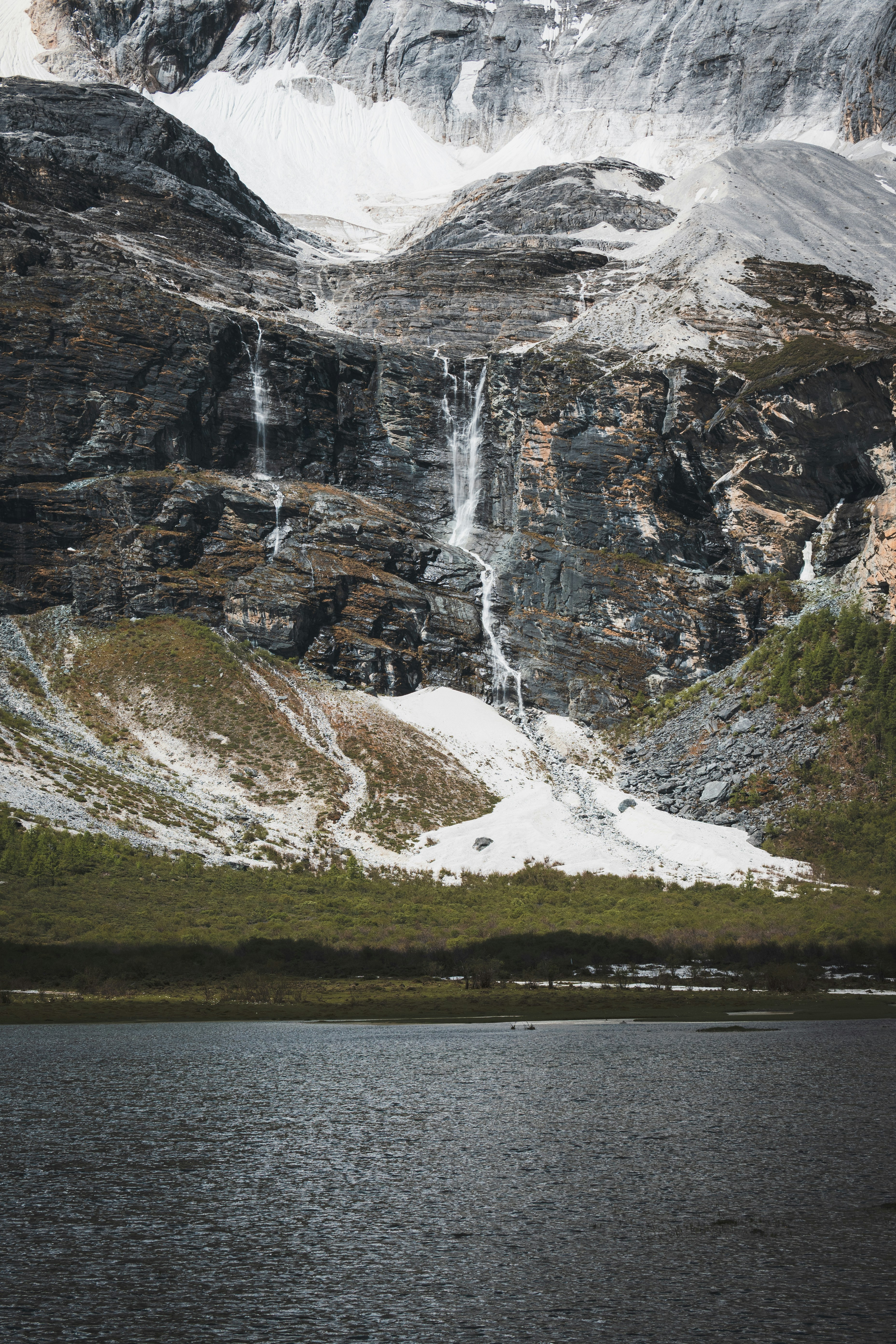 Glacial Cascade Above a tranquil lake