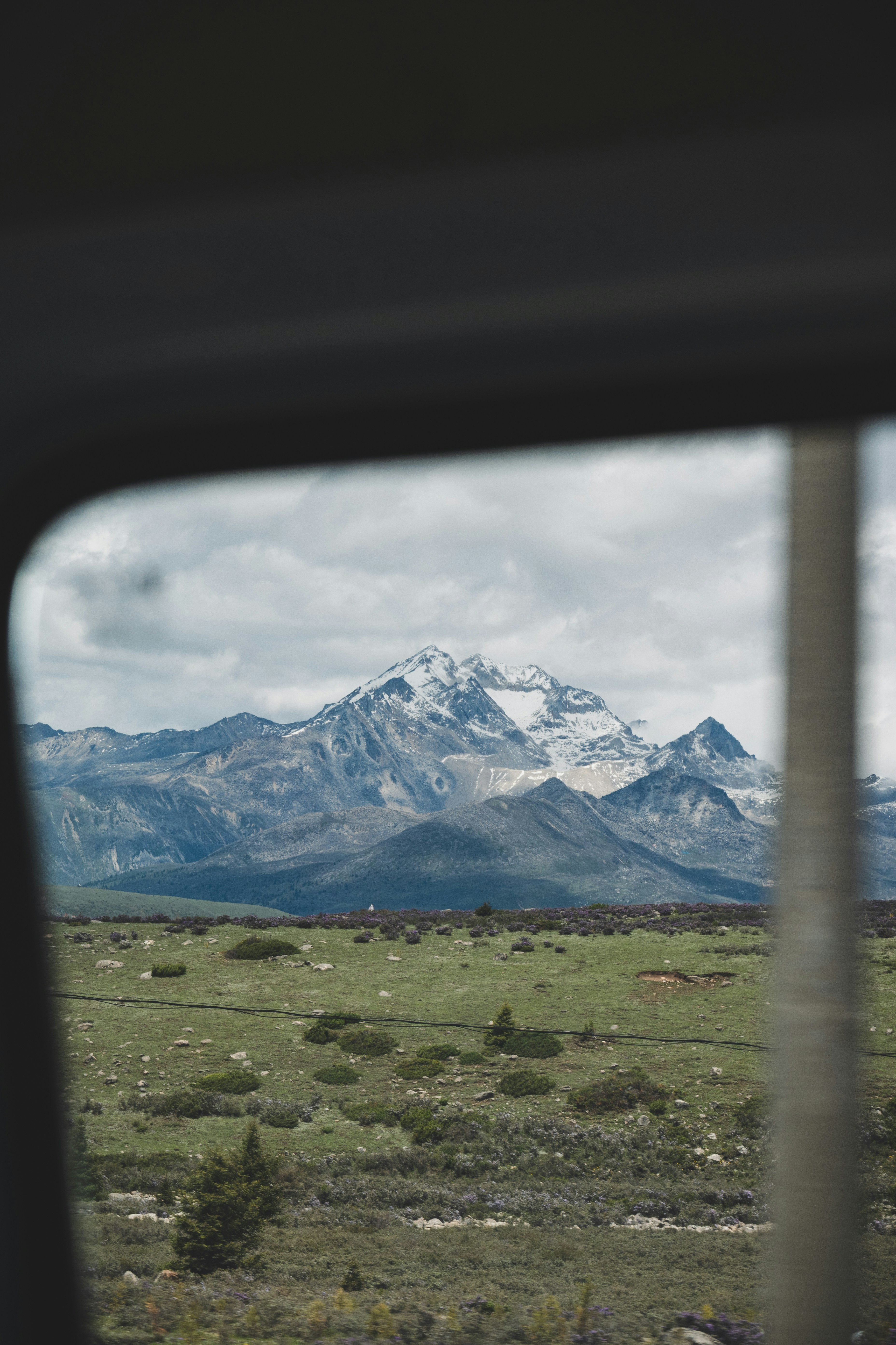 Mountain Range Framed by Vehicle Window