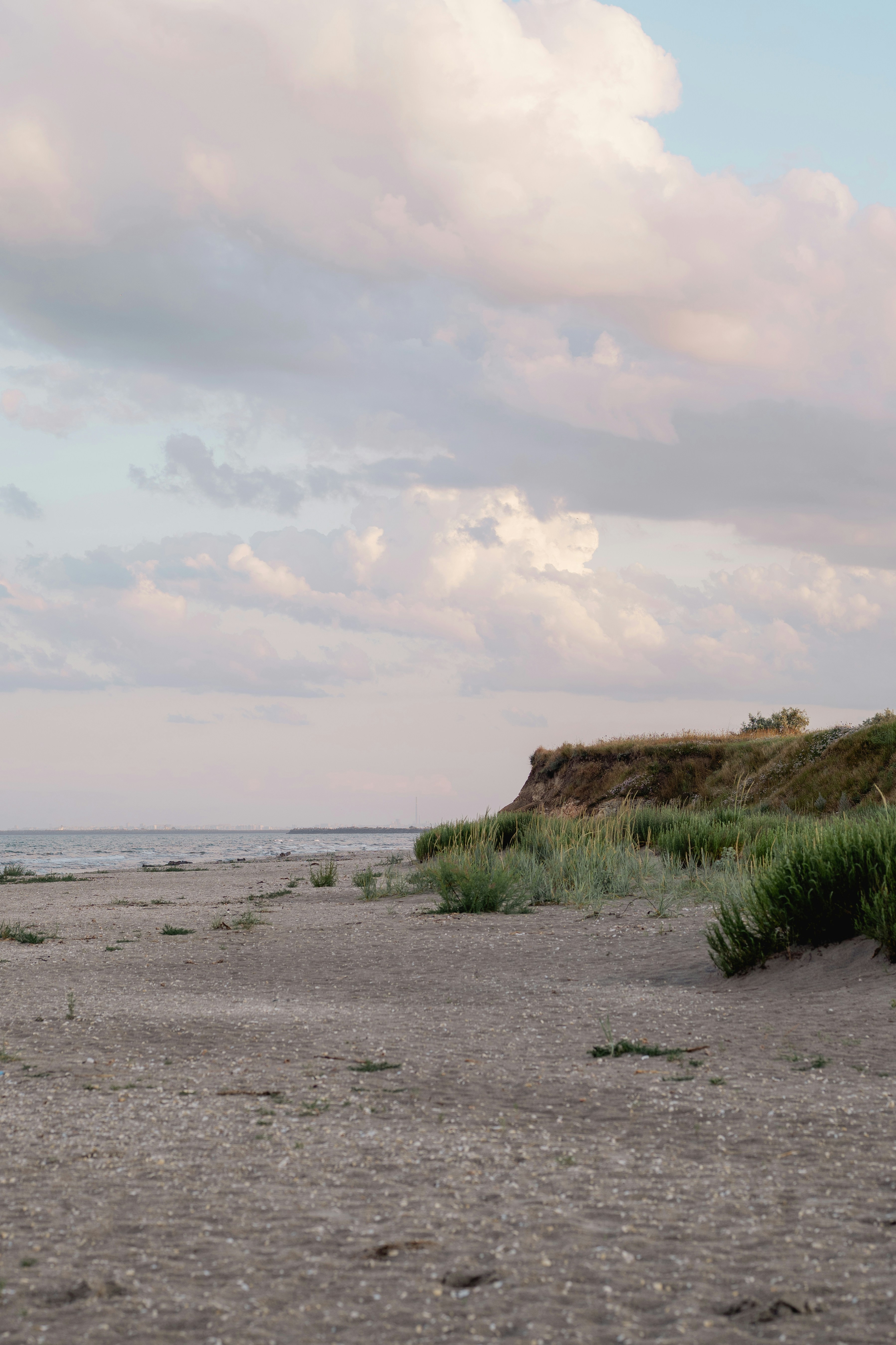 Cliffside Dunes at Sunset: Quiet Shoreline with Sagebrush and Sea