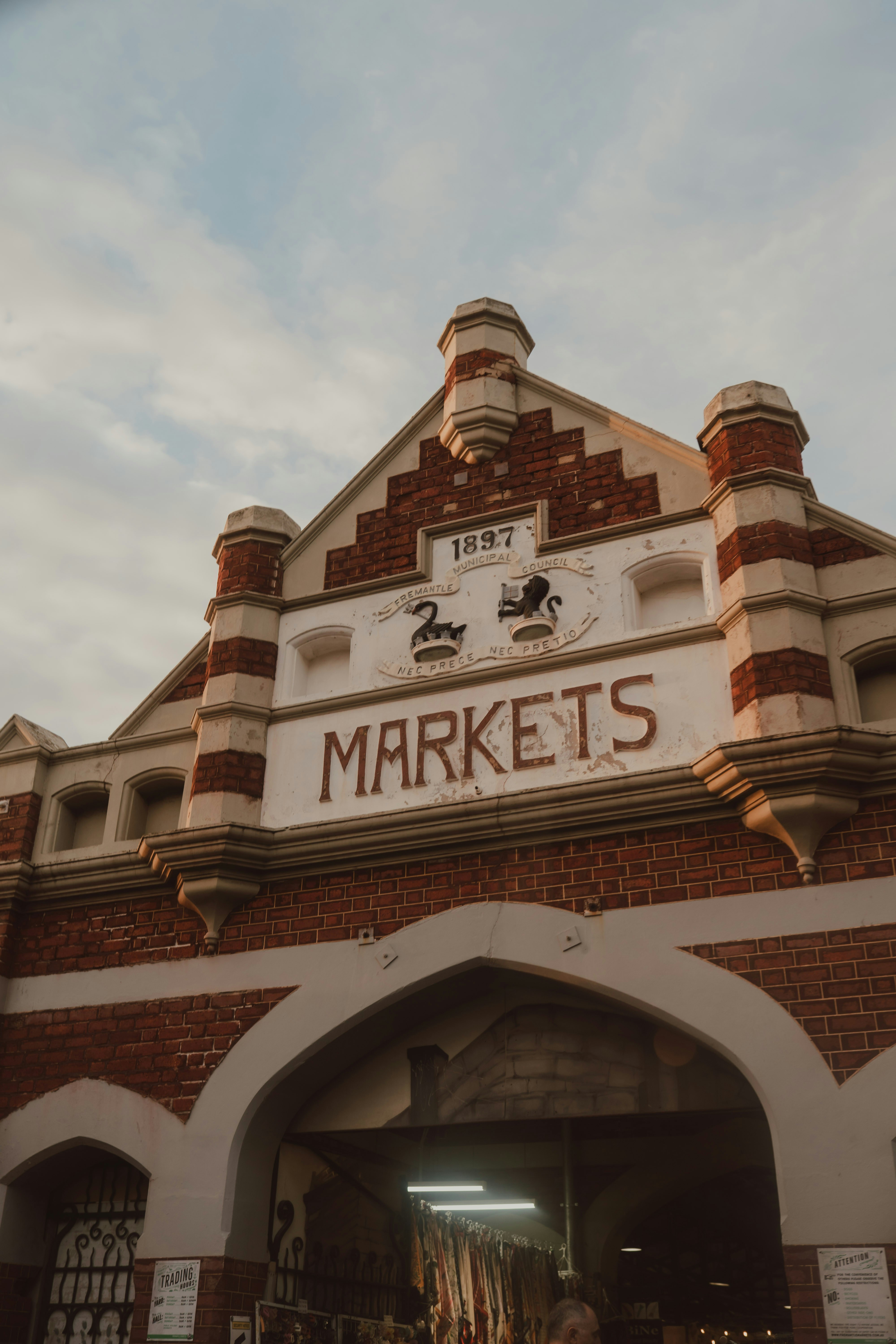 1897 Markets Facade: Brickwork Signage and Archway