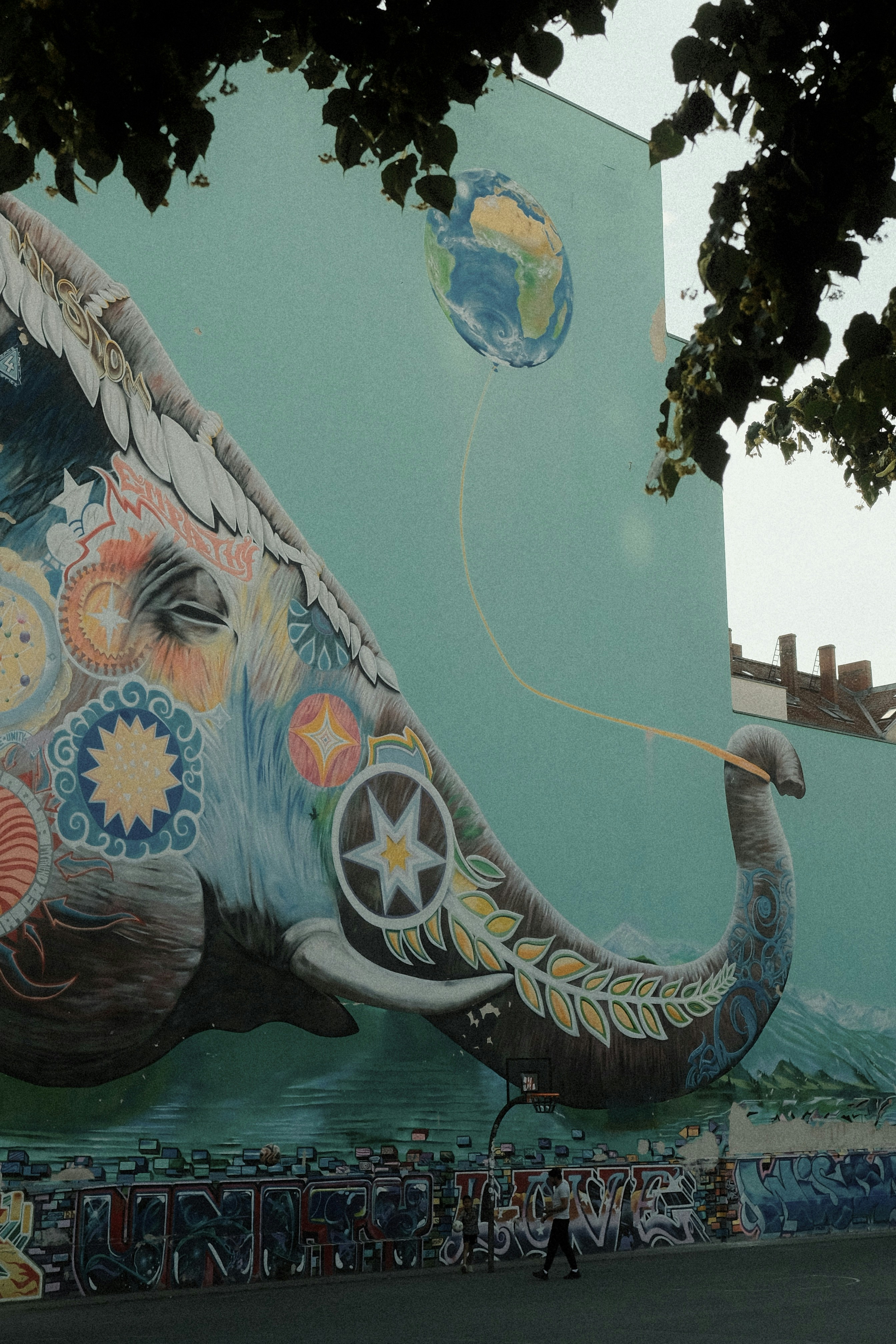 Colorful Street-Elephant Mosaic Reaching Toward the Sky