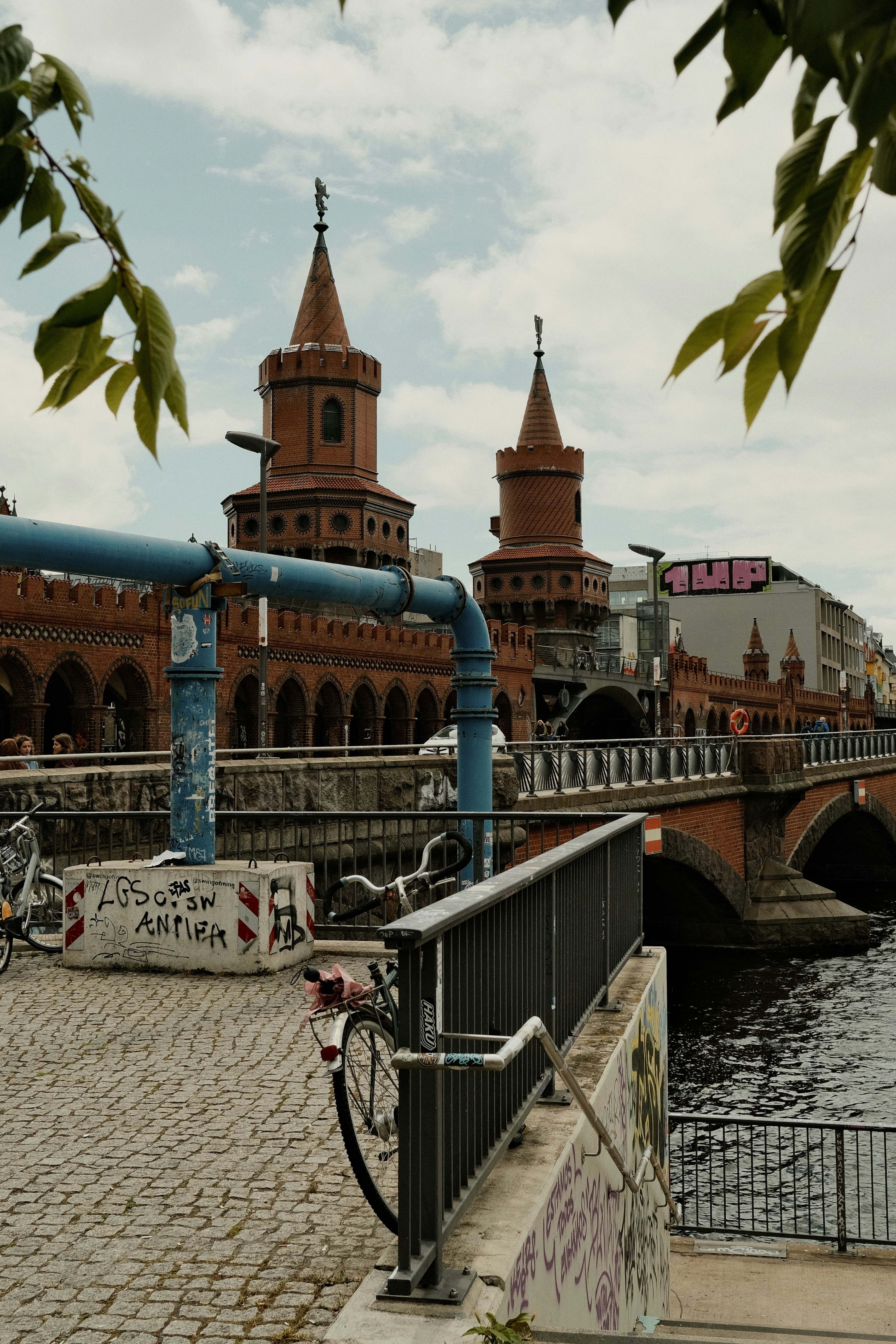 Bridge Vista: Brick Towers and Riverside Promenade