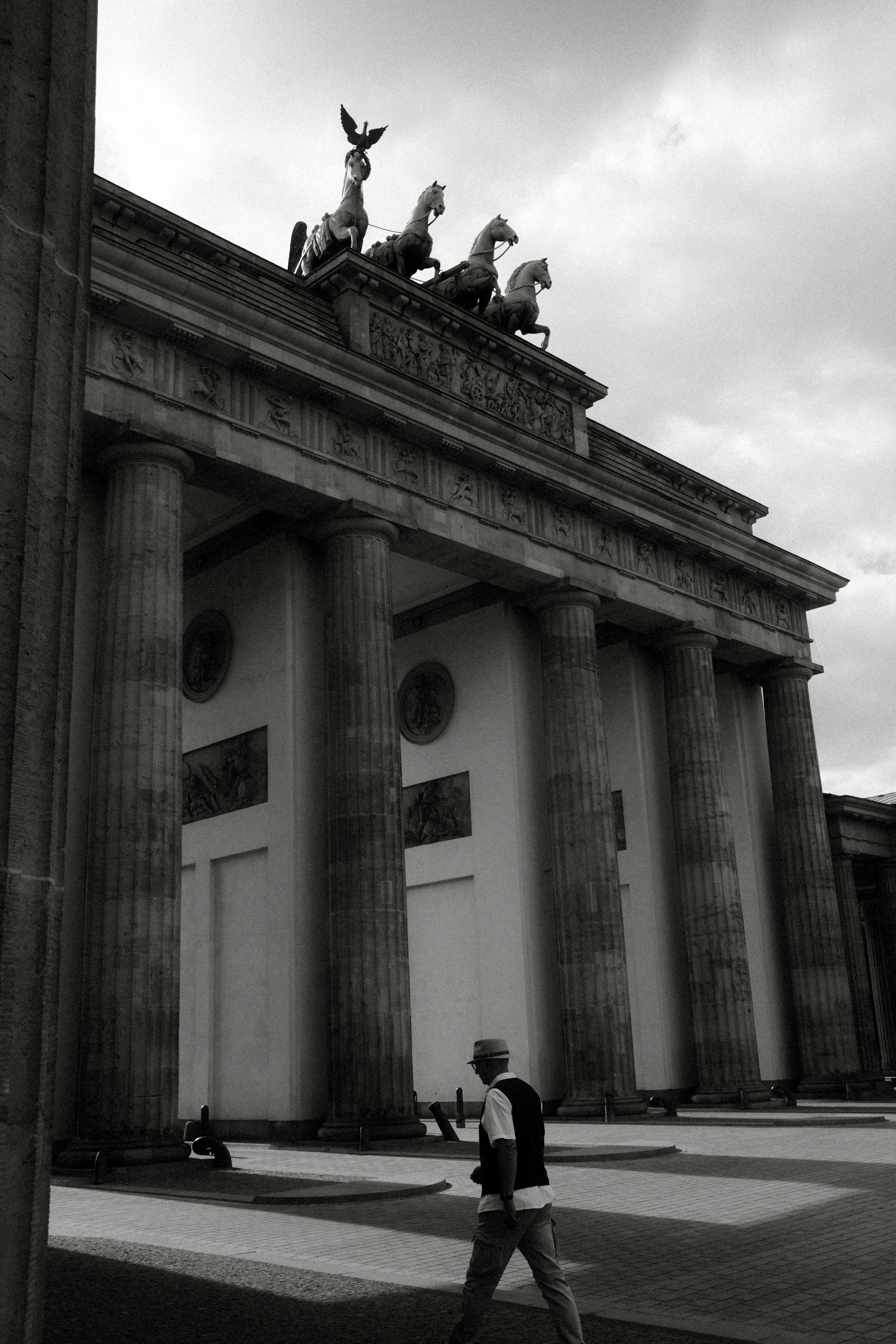 Guarded Stairs of Stone: A Lone Visitor in a Monumental Frame