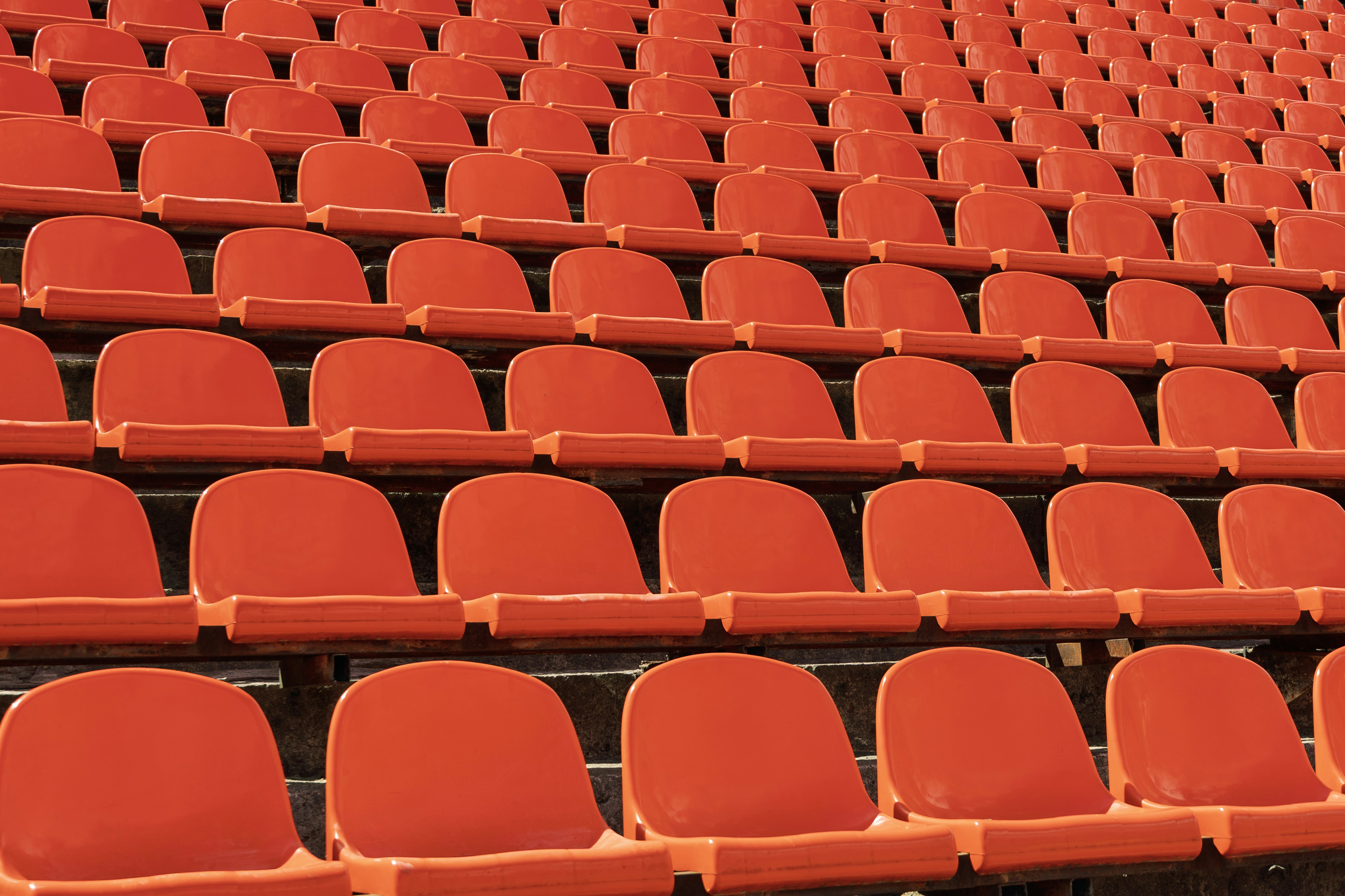 Red Waves of Stadium: Rows of Empty Seats