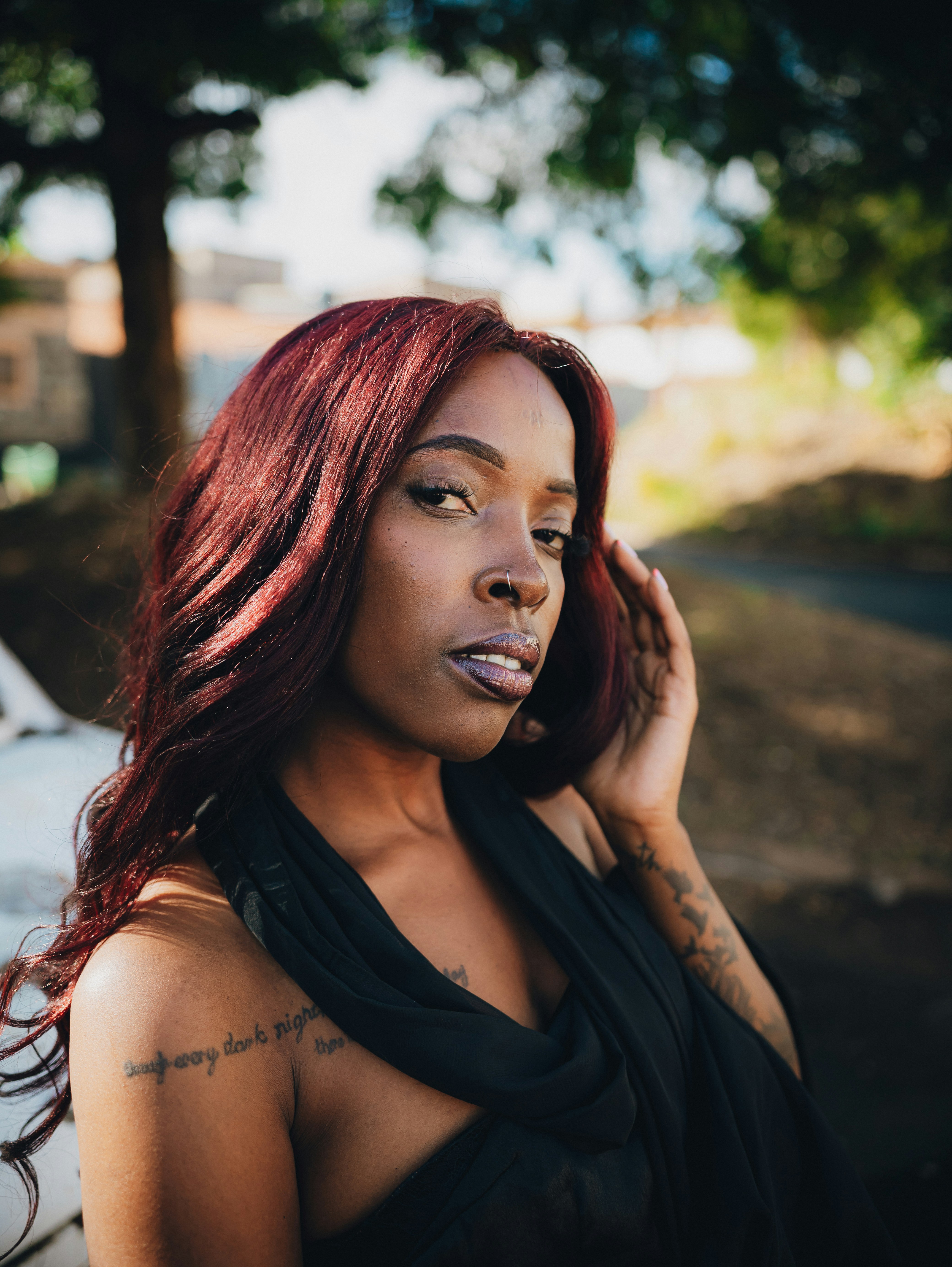 Velvet Hair and Quiet Confidence: A Portrait in Sunlit Shadows