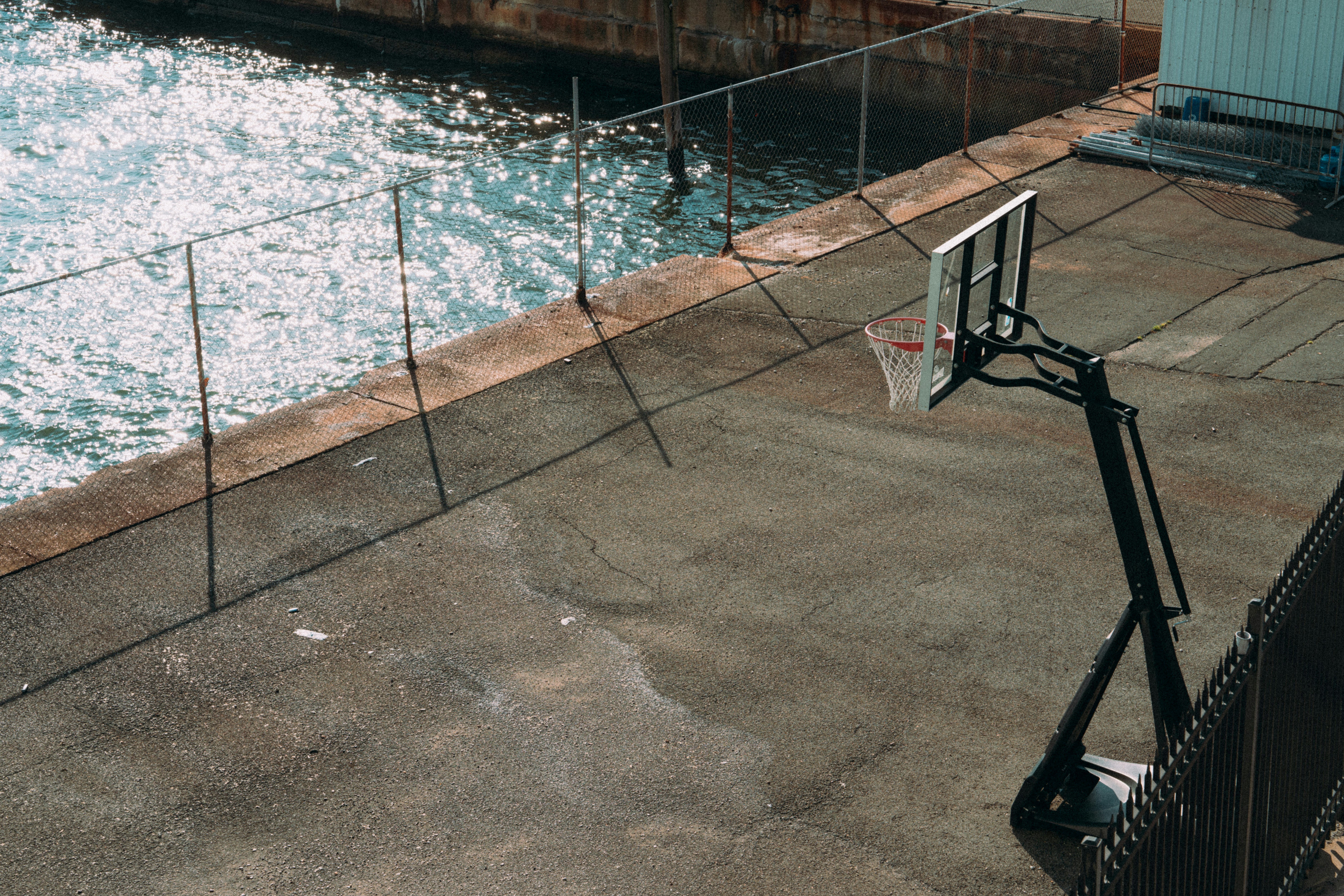 Basketball Hoop at a Quiet Waterfront Court