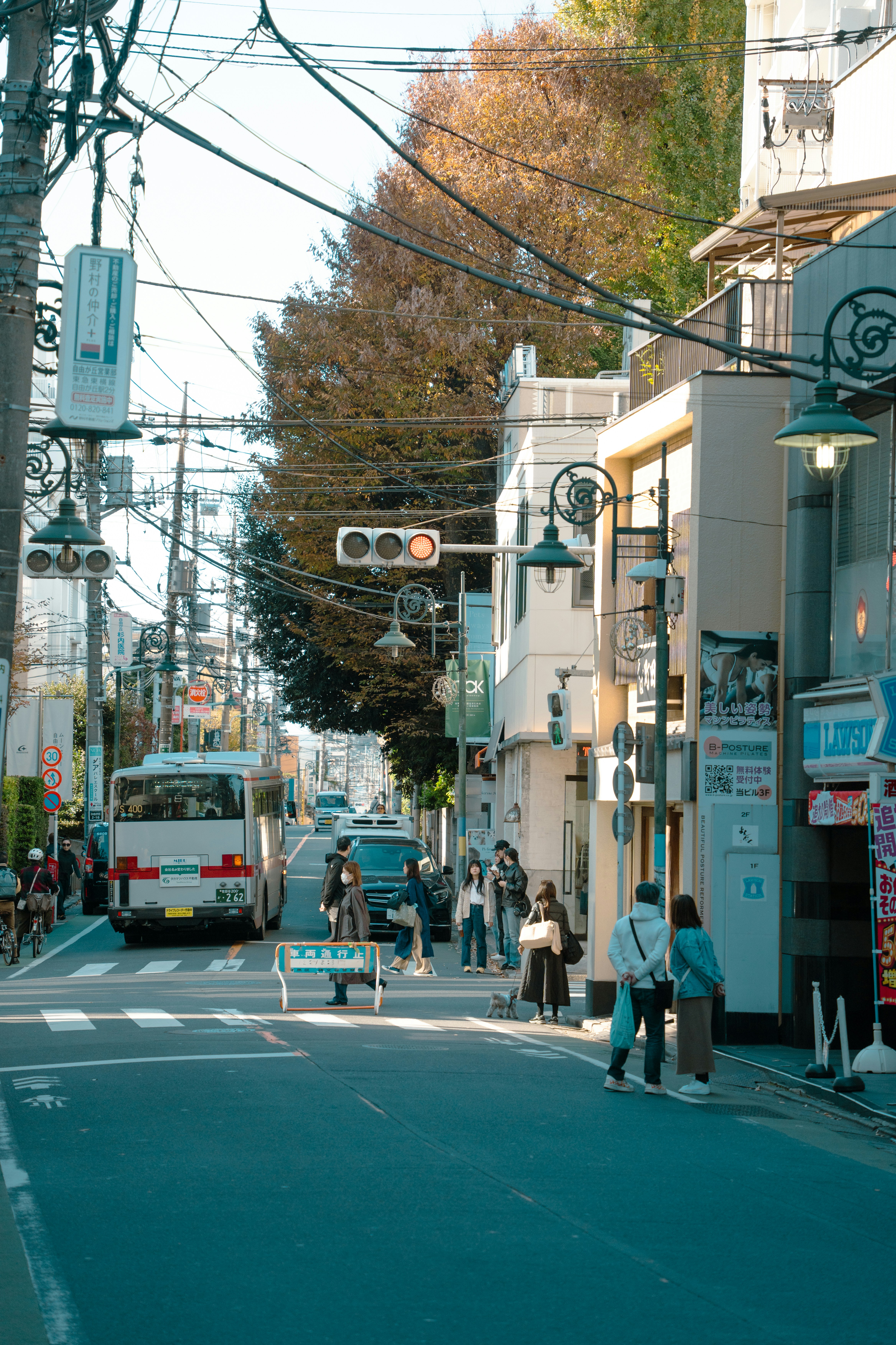 Urban Crossroads: People, Bus, and Wires in a Neon-Cooled Street
