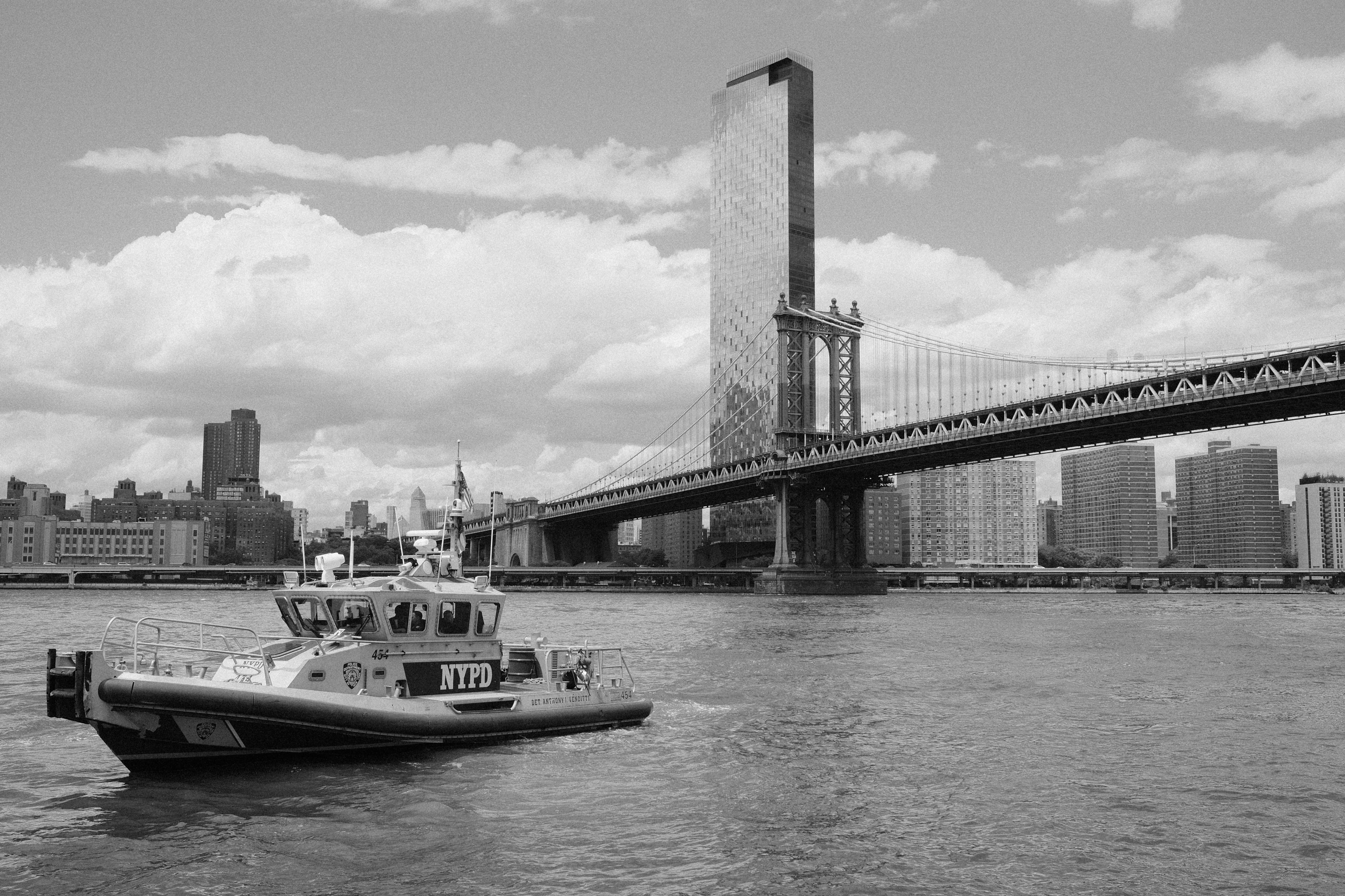 Toward the City: A NYC Police Boat at the Riverside Crossing