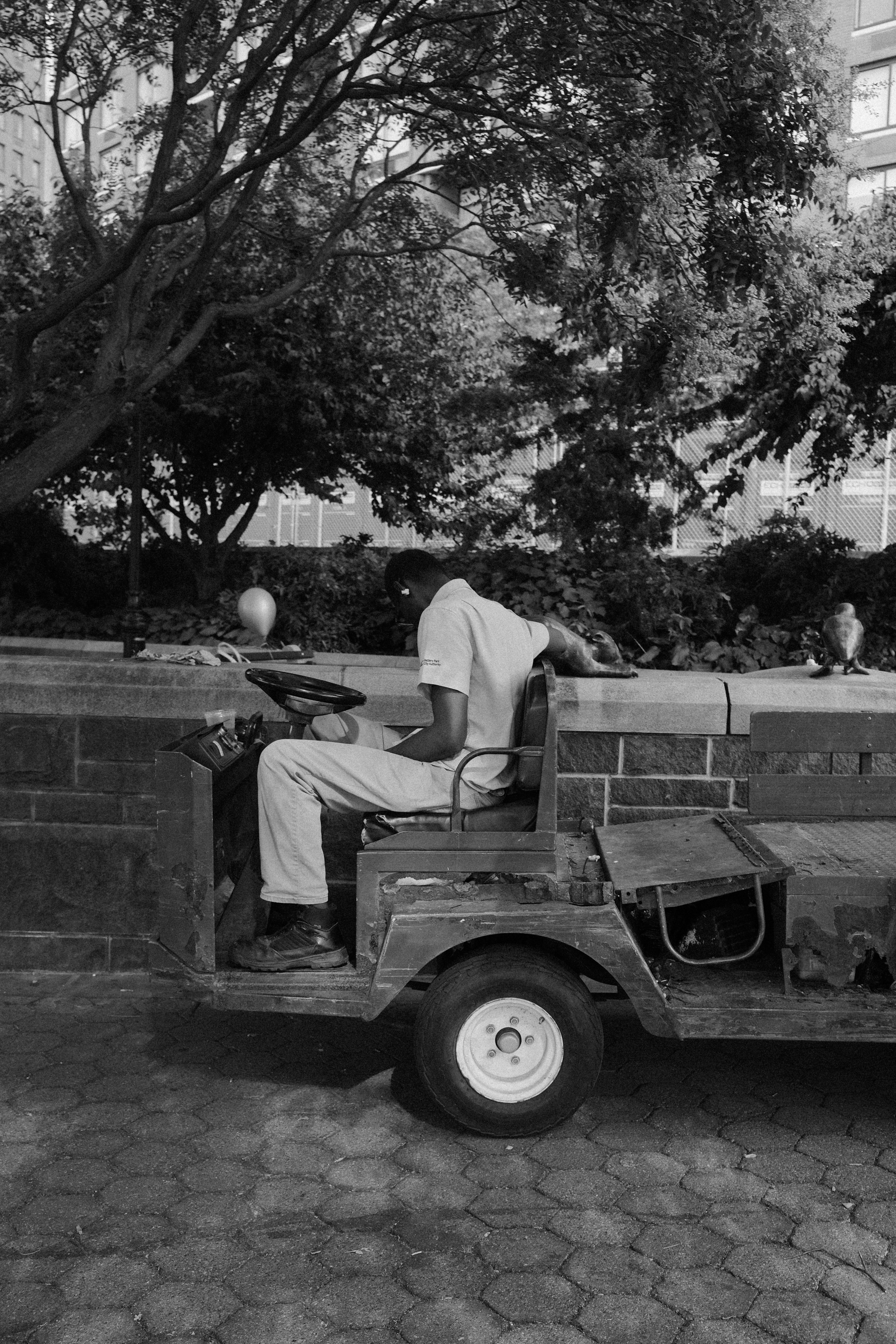Quiet Worker in a Brick-Backed Street Portrait