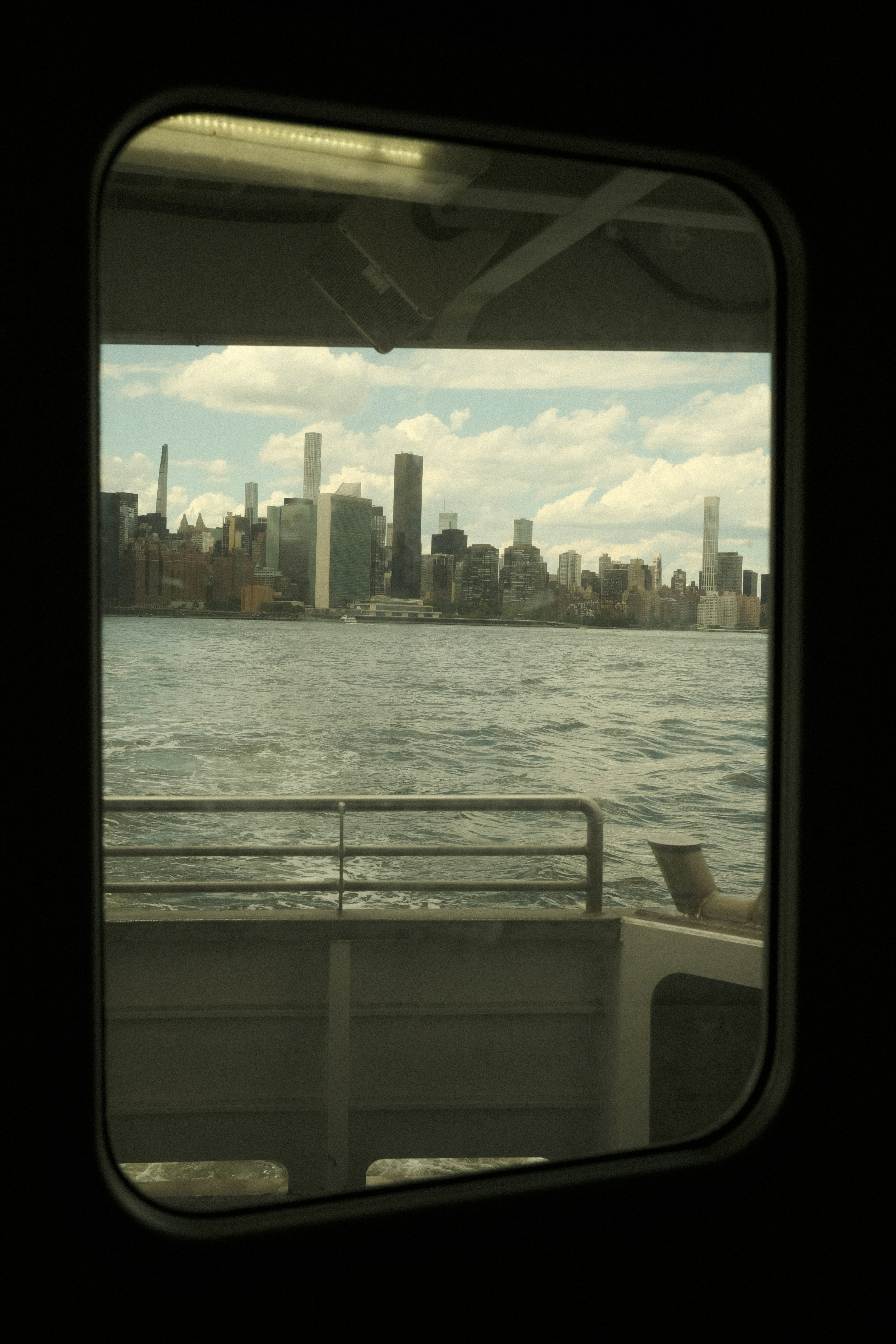 Harbor Window: Cityscape Beyond the Vessel