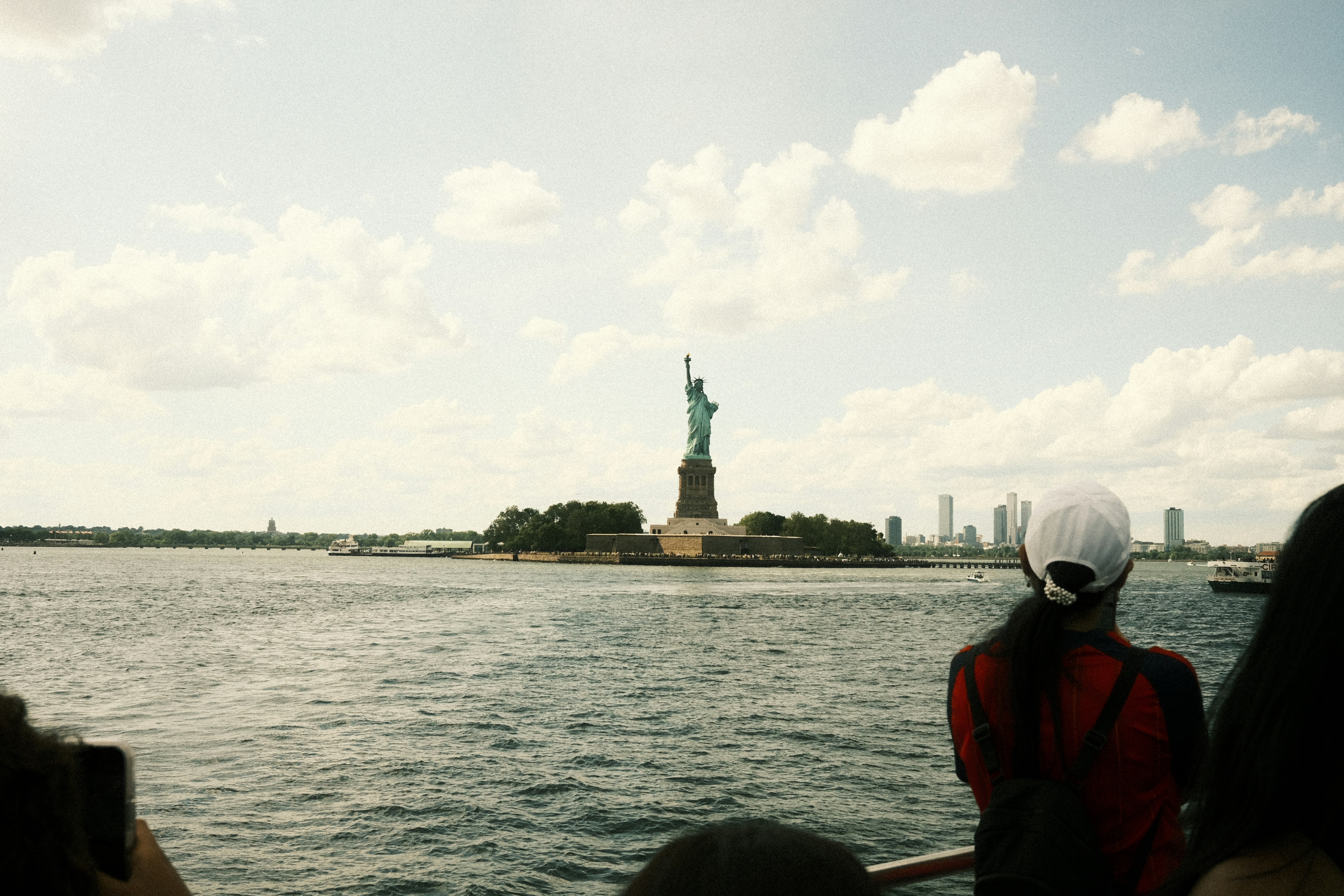 Lady of Liberty on a sunlit harbor cruise
