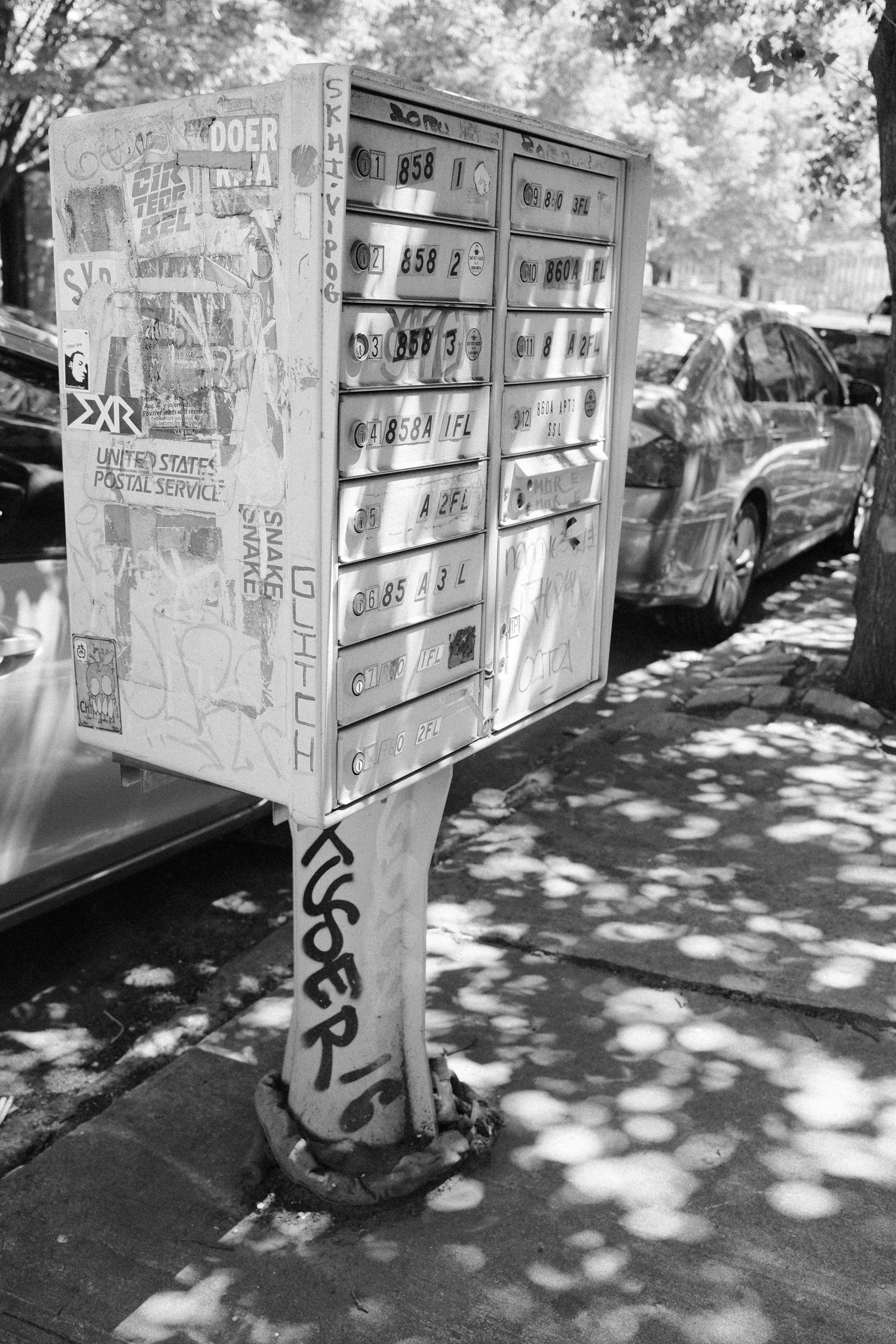 Ghost of Post: A Graffitied Mailbox on a City Block