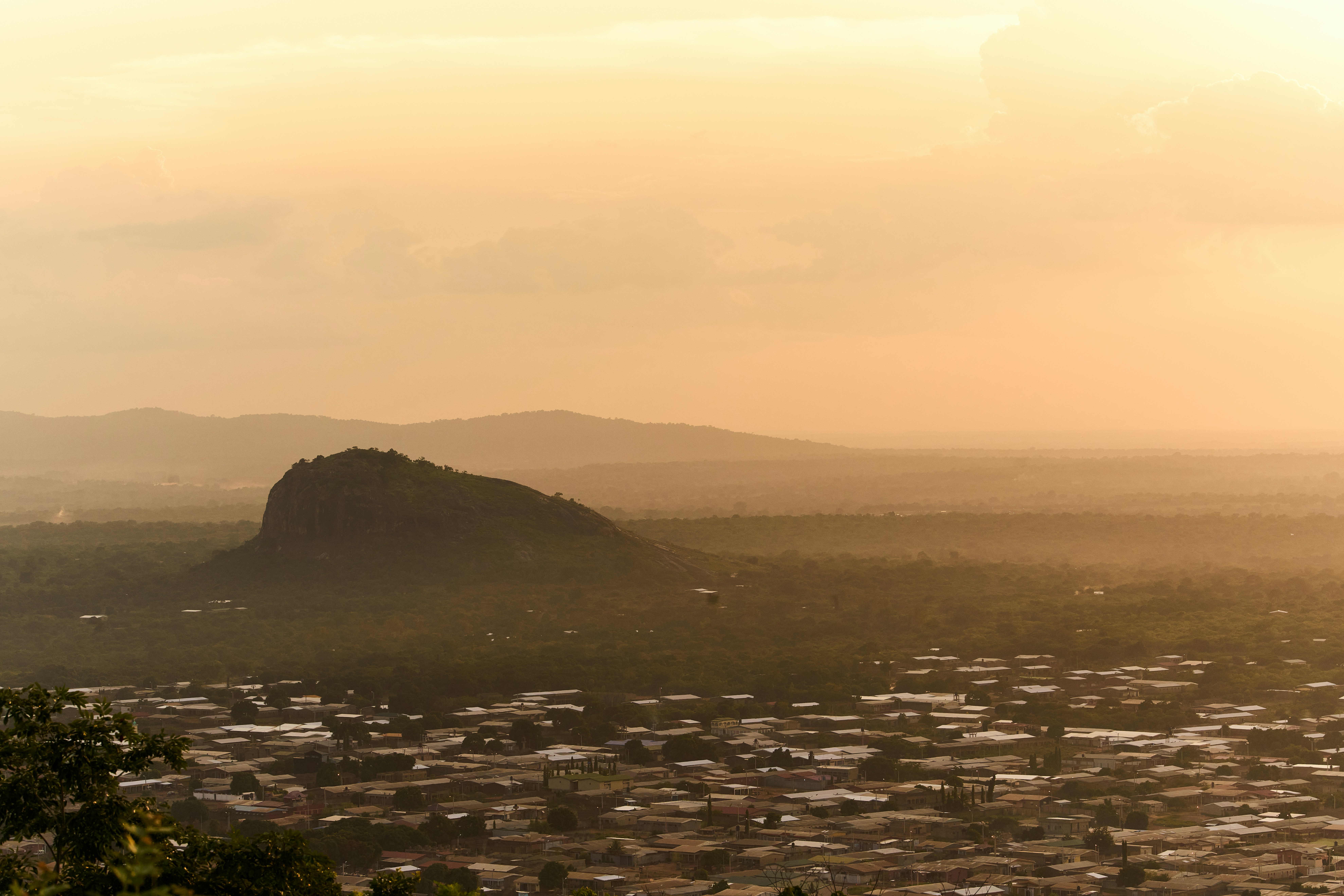 Distant Plateaus Over a Quiet City at Dusk