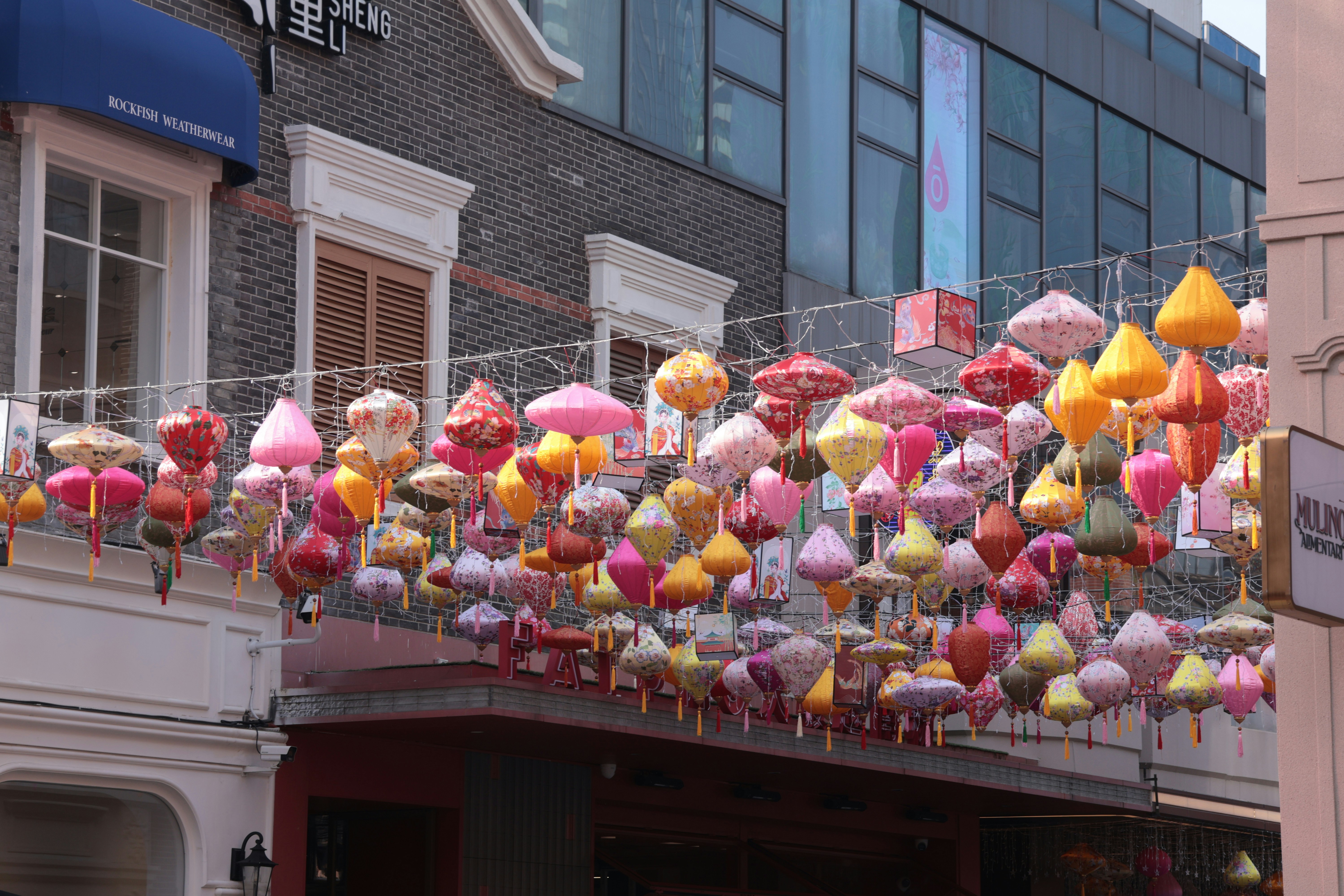 Colorful Lantern Canopy Over an Urban Street