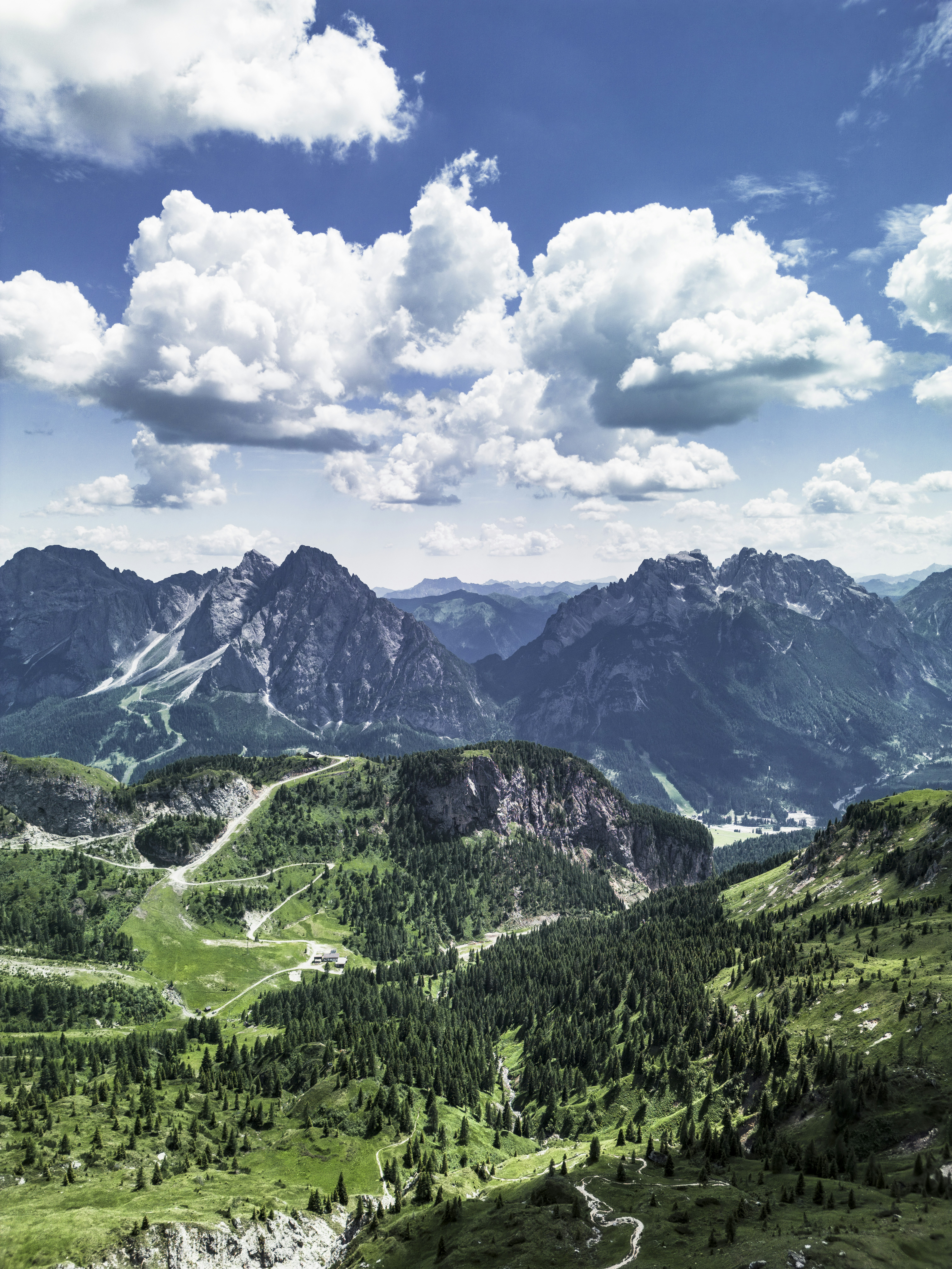 Trail Threading Through Alpine Basins Beneath Majestic Peaks