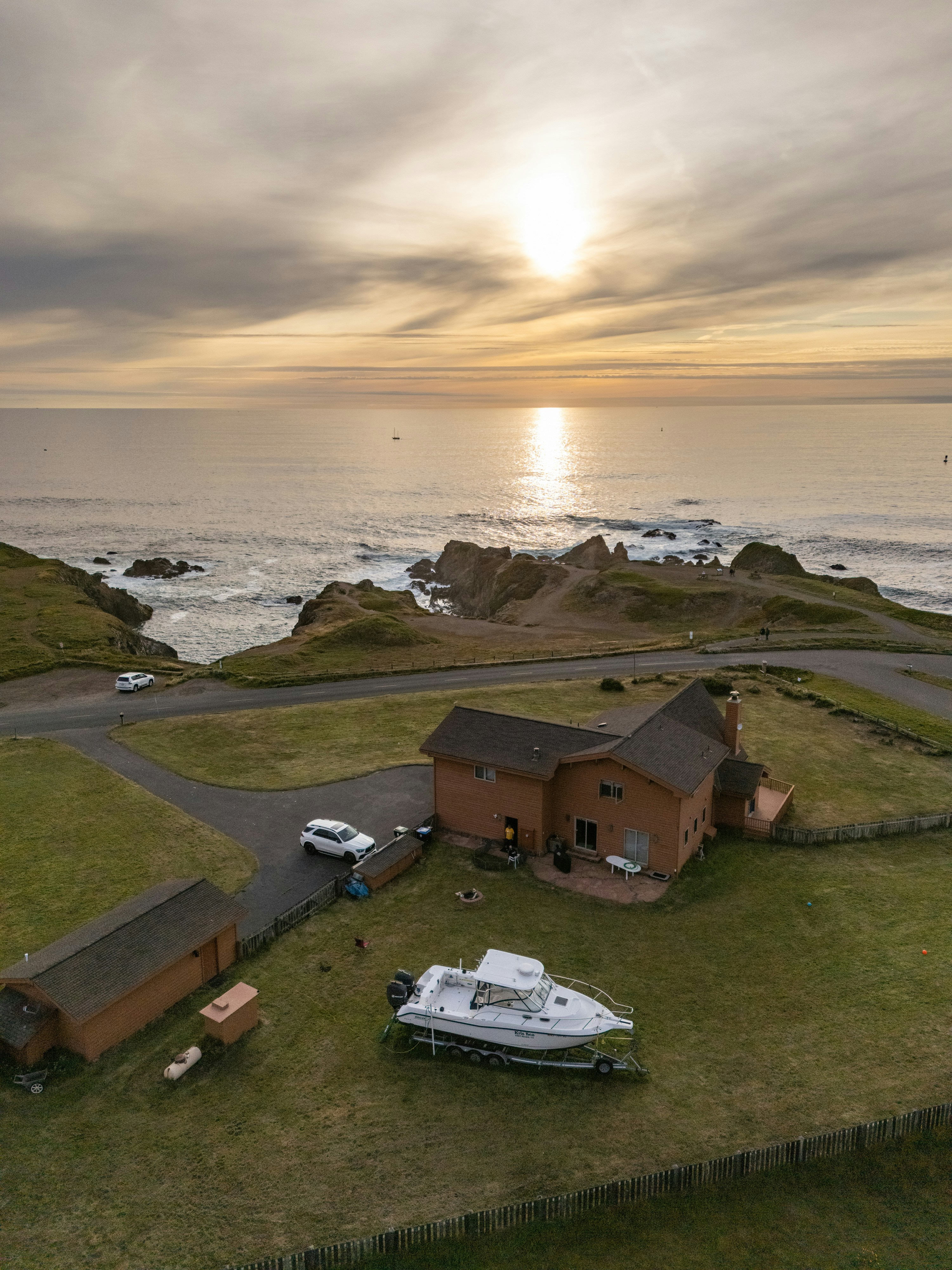 Sunlit Cove: A Quiet Boatyard Beneath a Golden Horizon