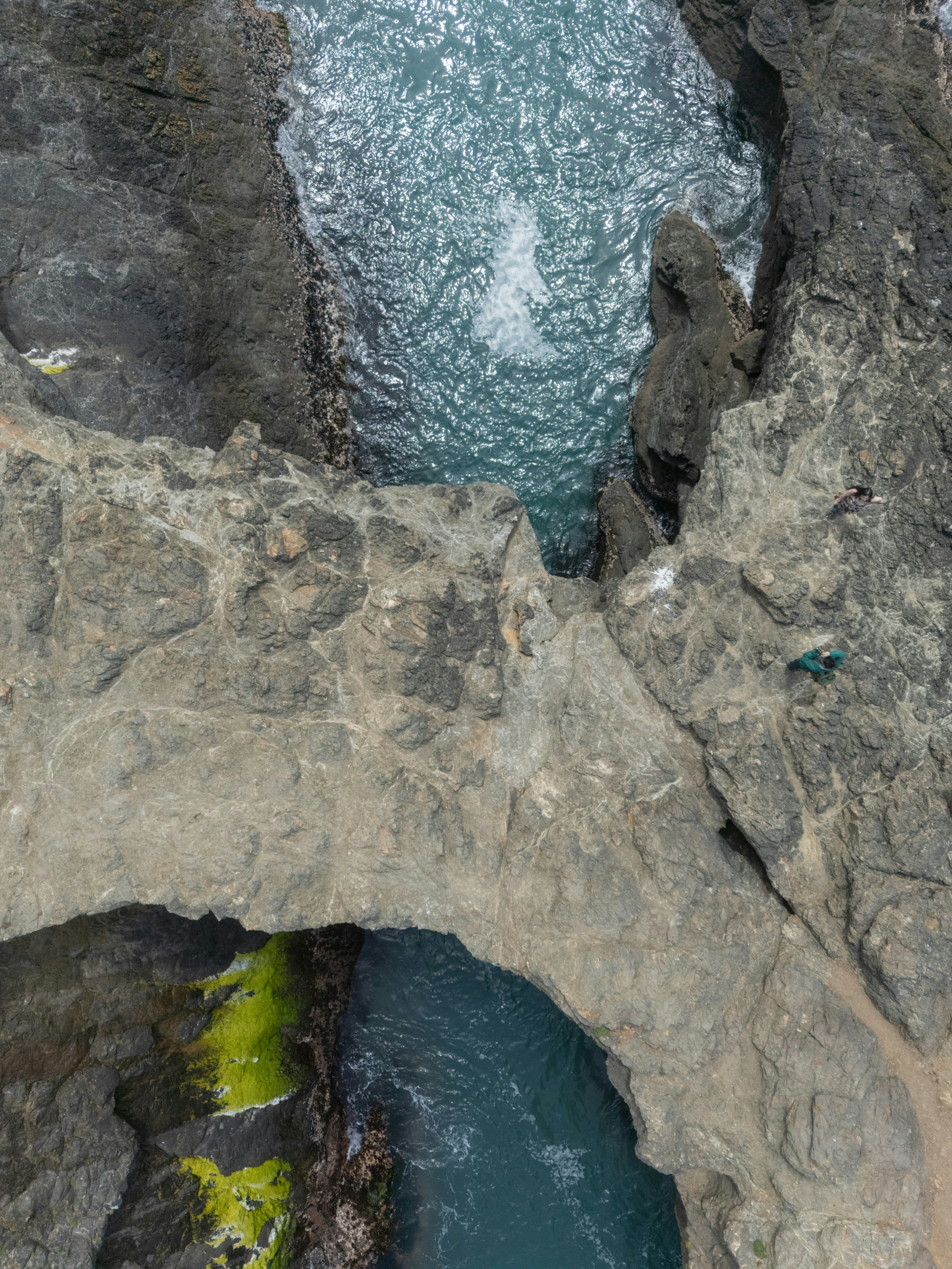 Cleft Over the Tidal Cove: A Natural Archway Seen from Above