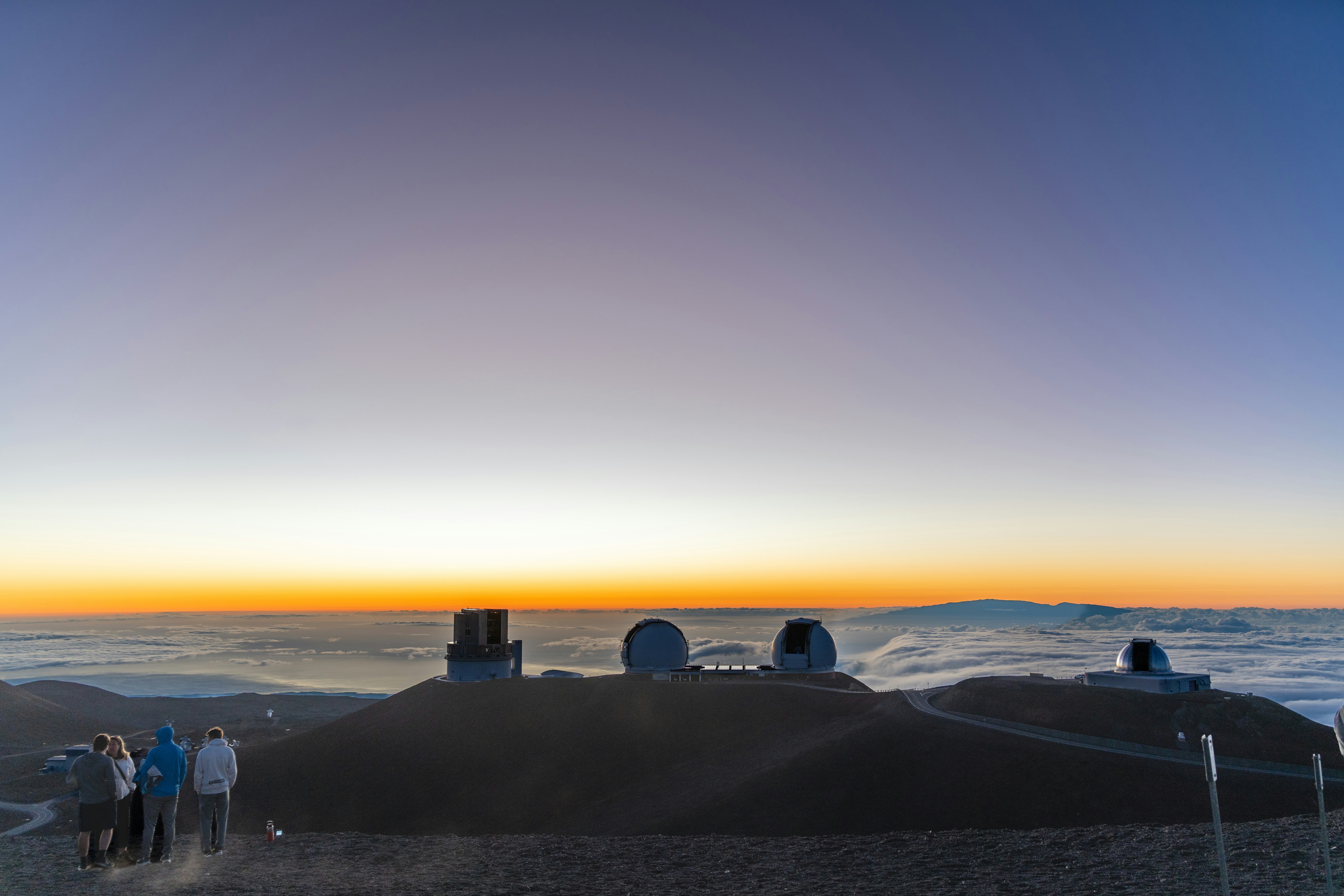 Observatories At Sunset: A Peak Above the Clouds