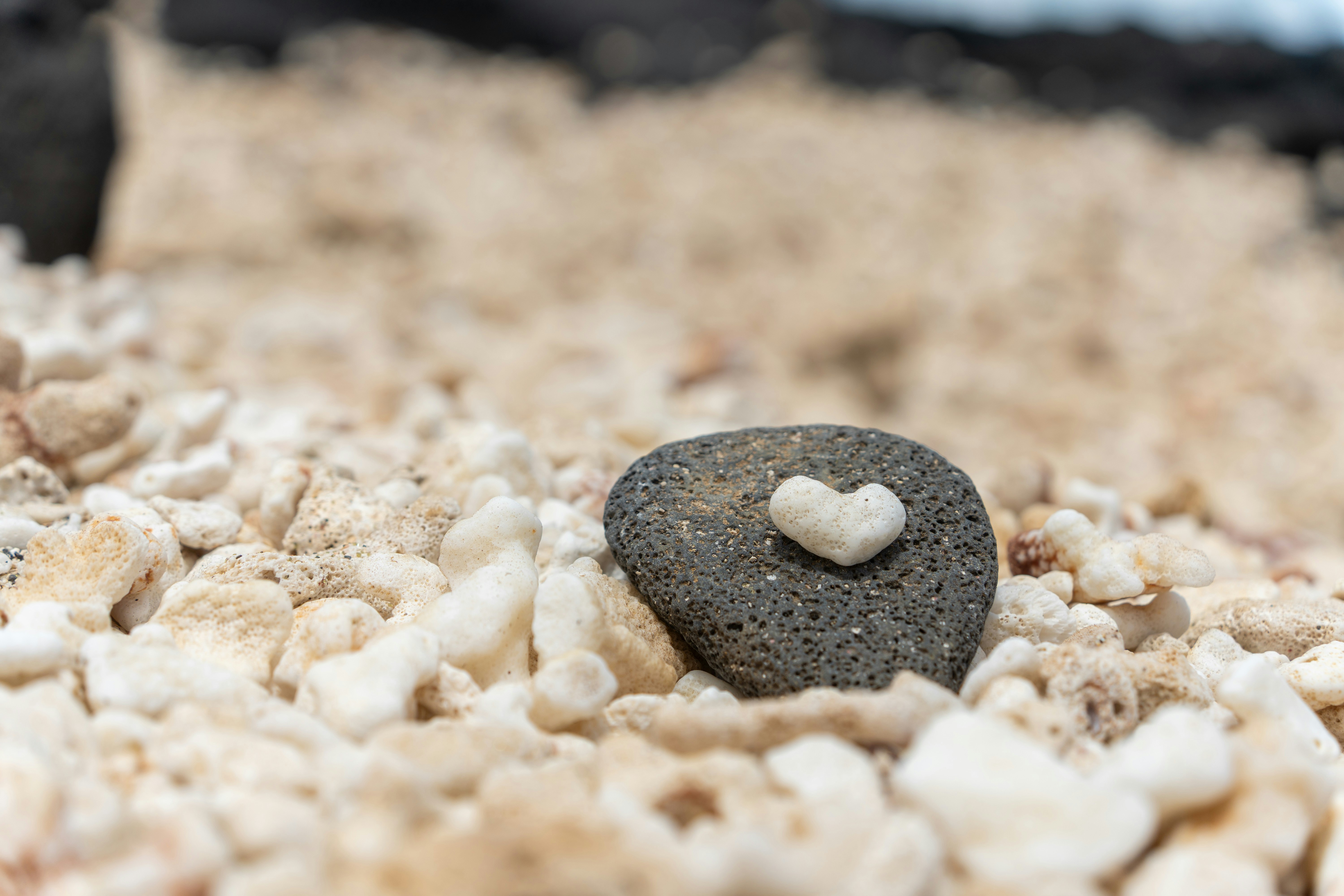 Heartstone on Pebbles: A Tiny Love Amid Coastal Gravel
