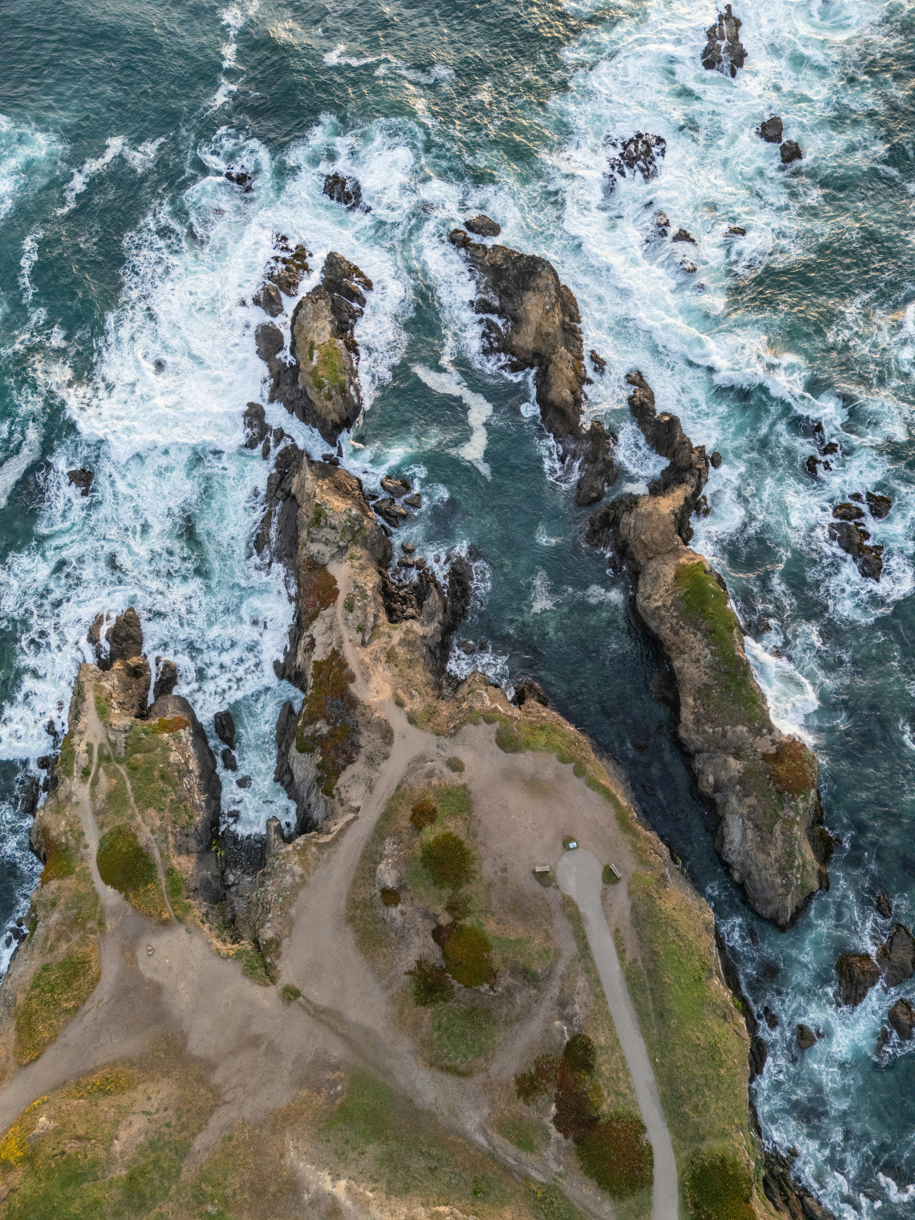Rugged Sea Fingers: A Drone's View of Wind-Washed Cliffs