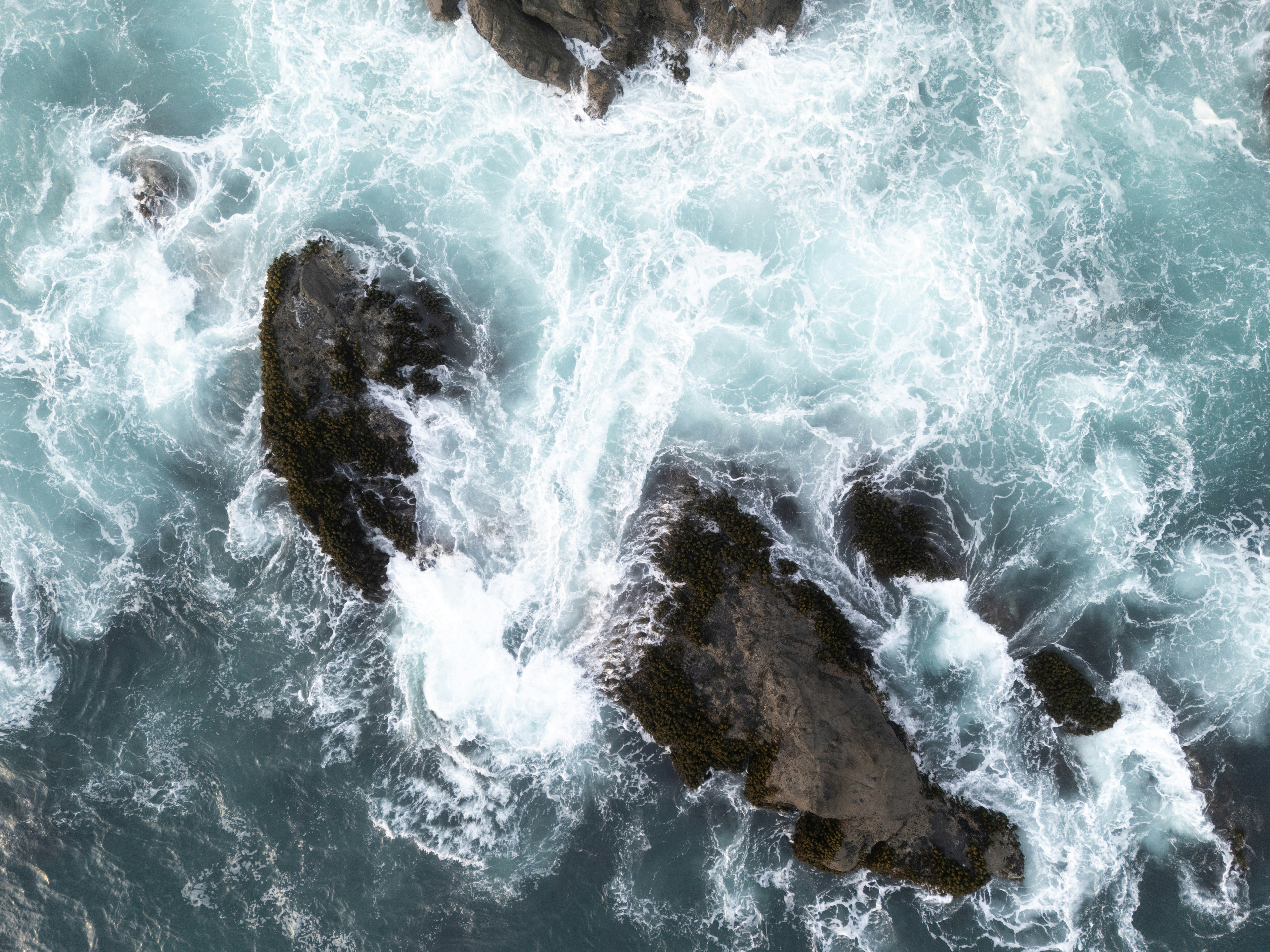 Rugged Seascape: Waves Converging on Coastal Rocks