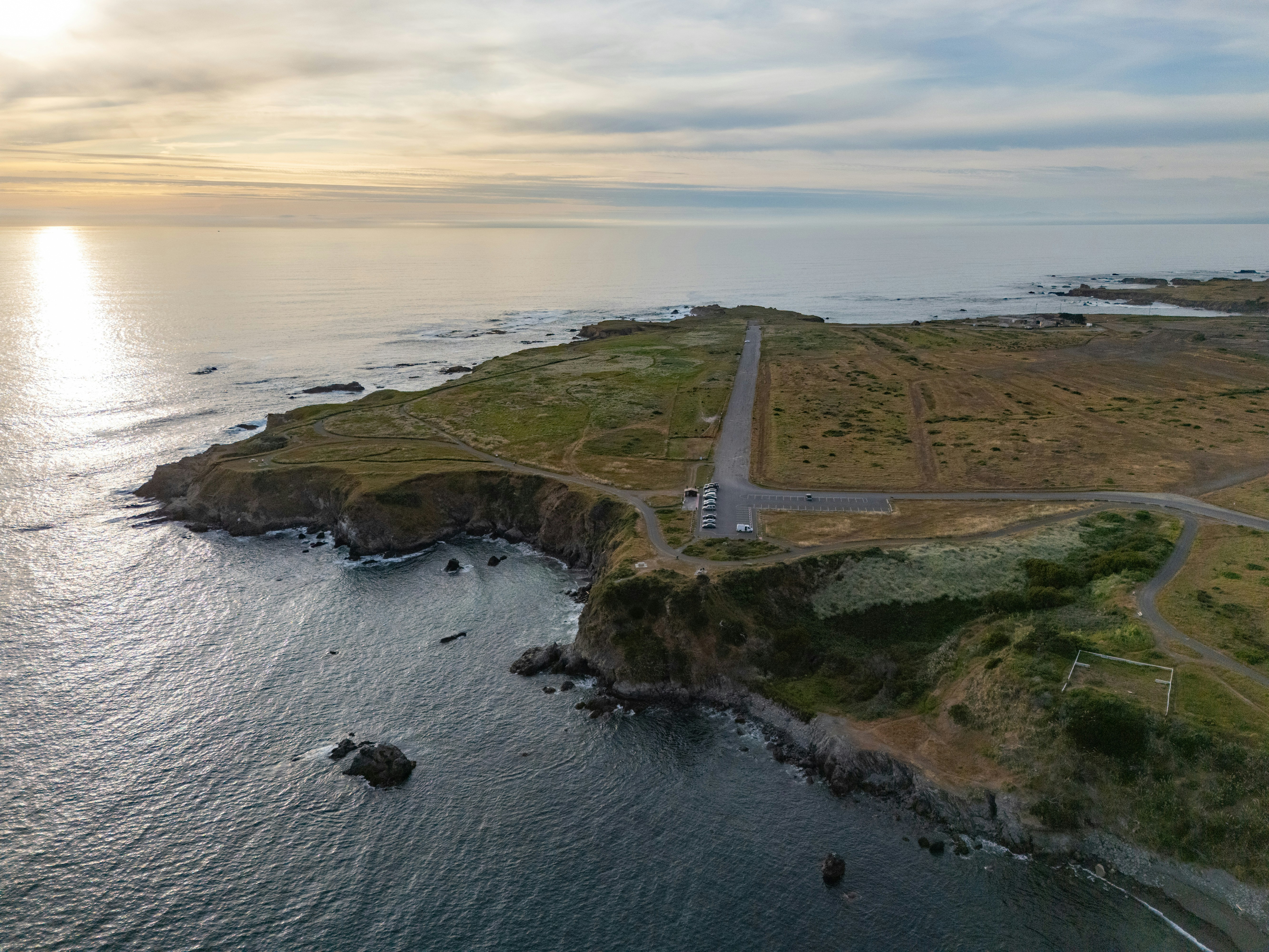 Coastal Promontory at Sunset: A Quiet Runway to the Sea