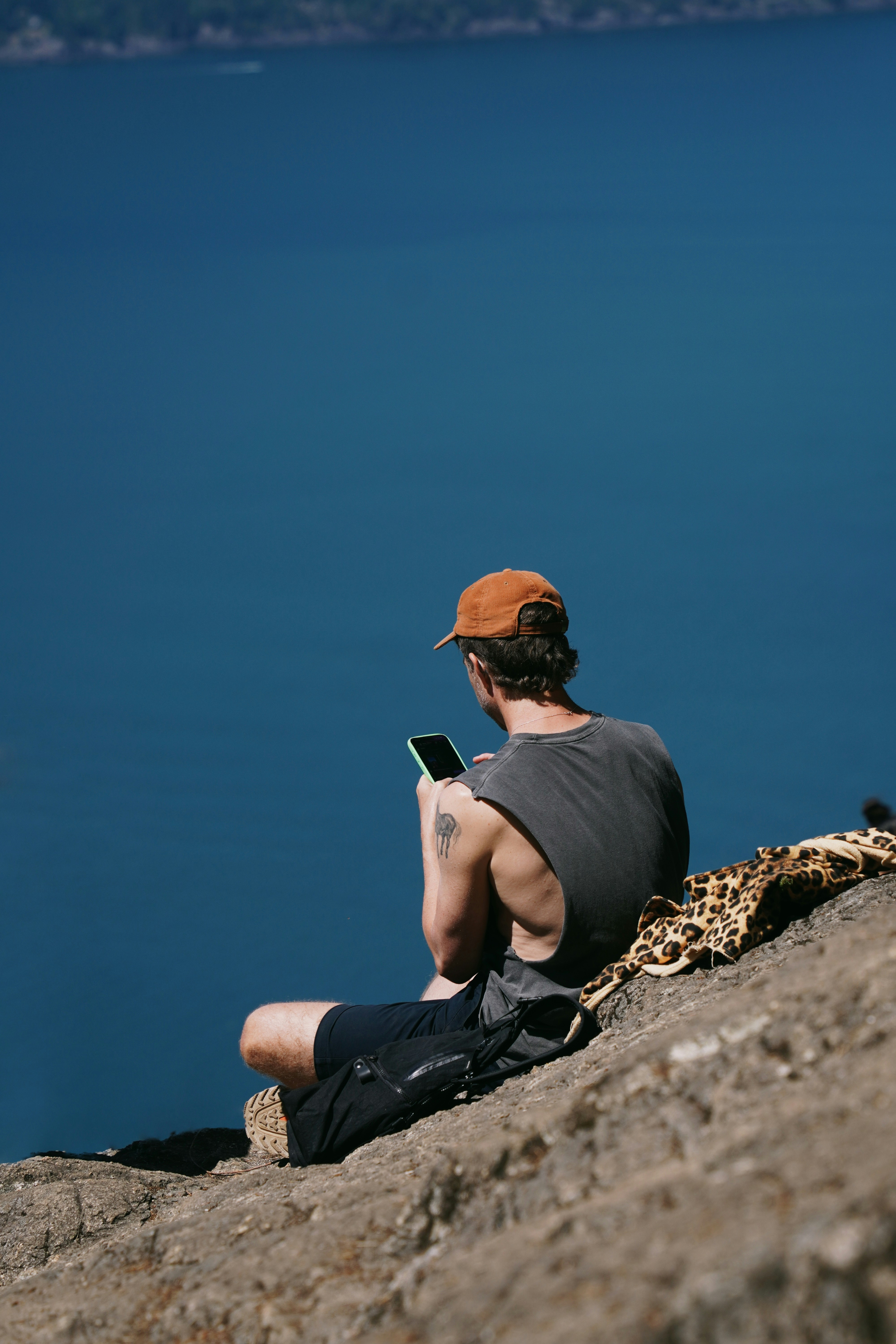 Quiet Focus: A Seated Moment Above the Blue Expanse