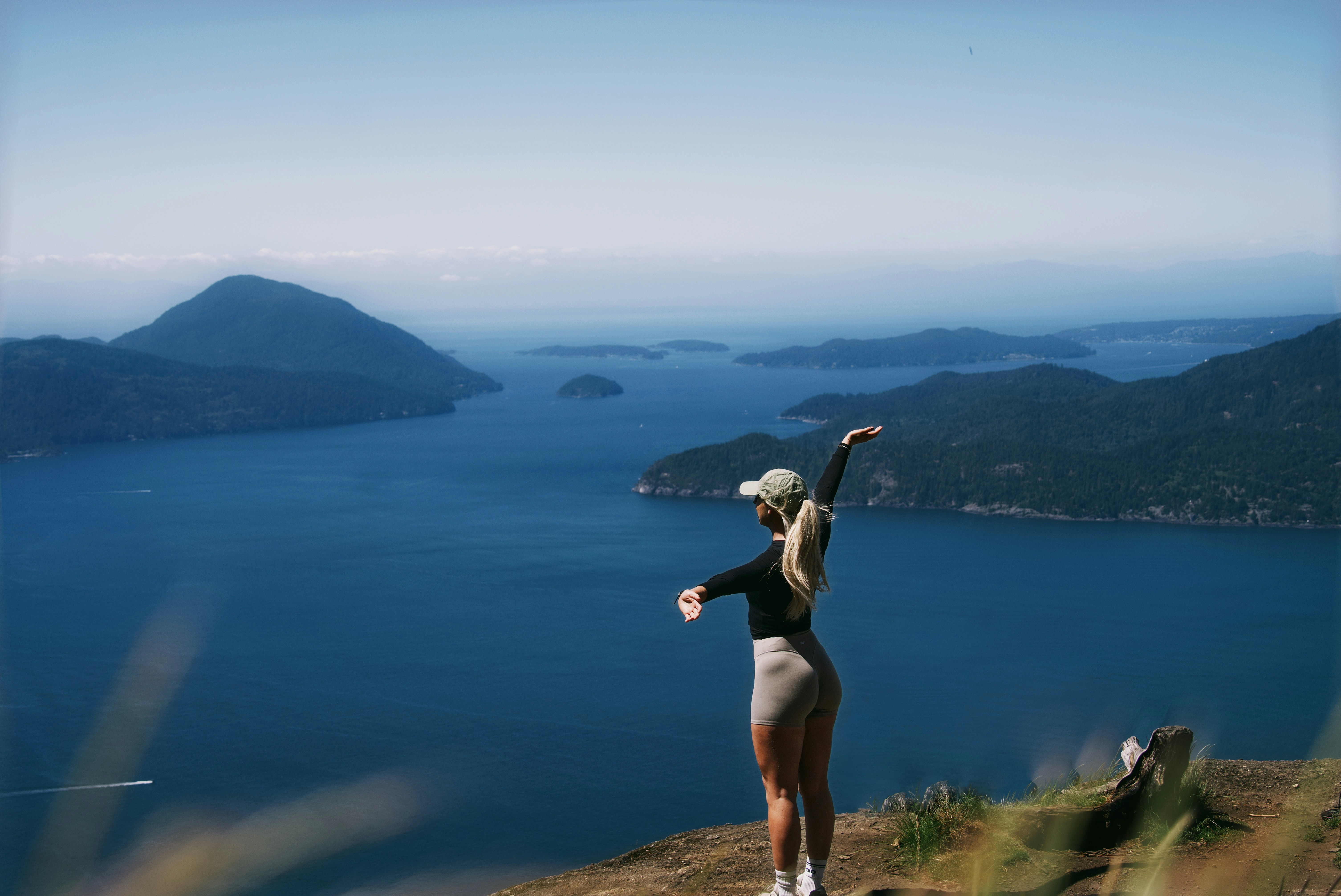 Trailside Freedom: a lone hiker at the edge of a blue expanse