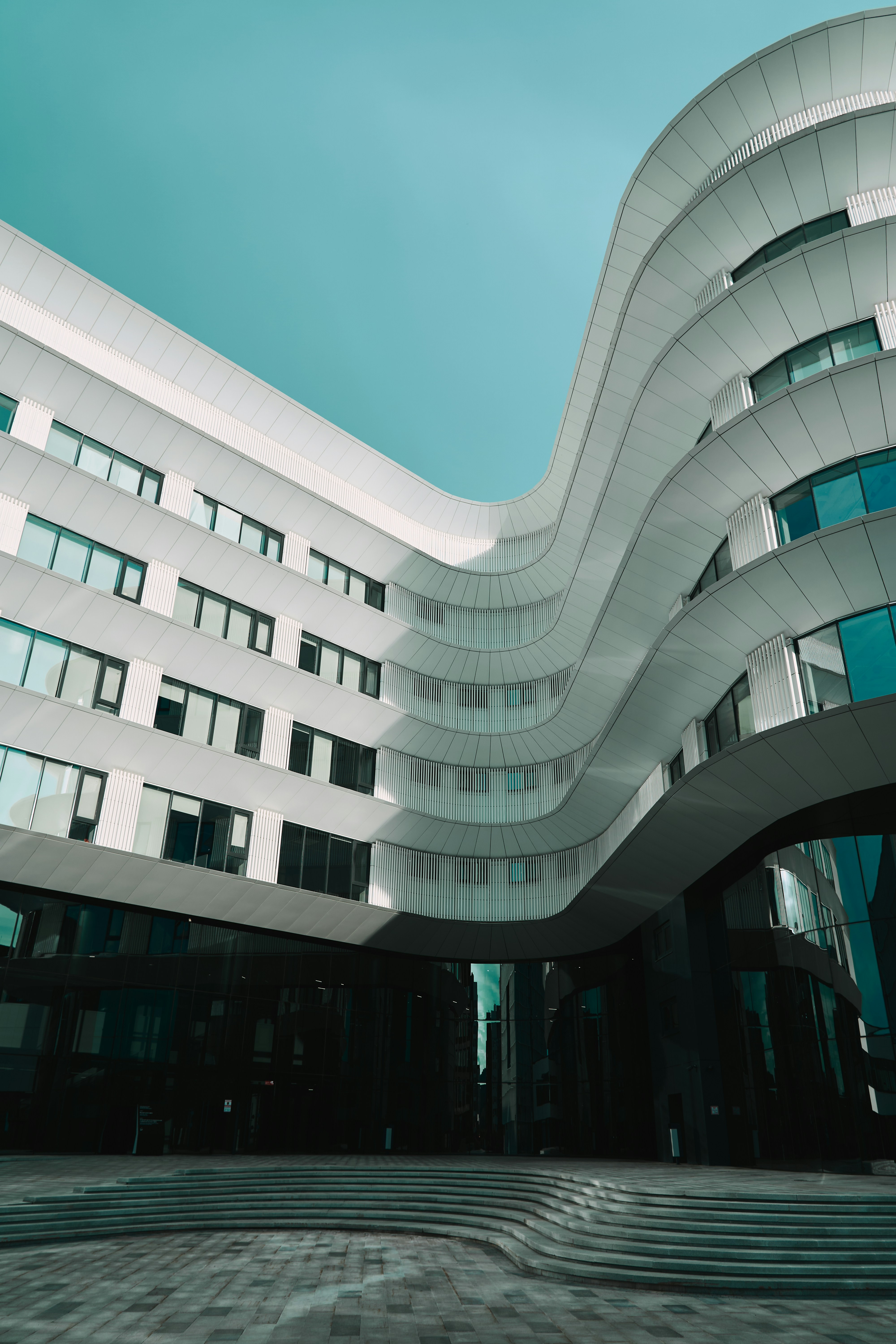 Curves of Modern Glass: The Bend of White Facades