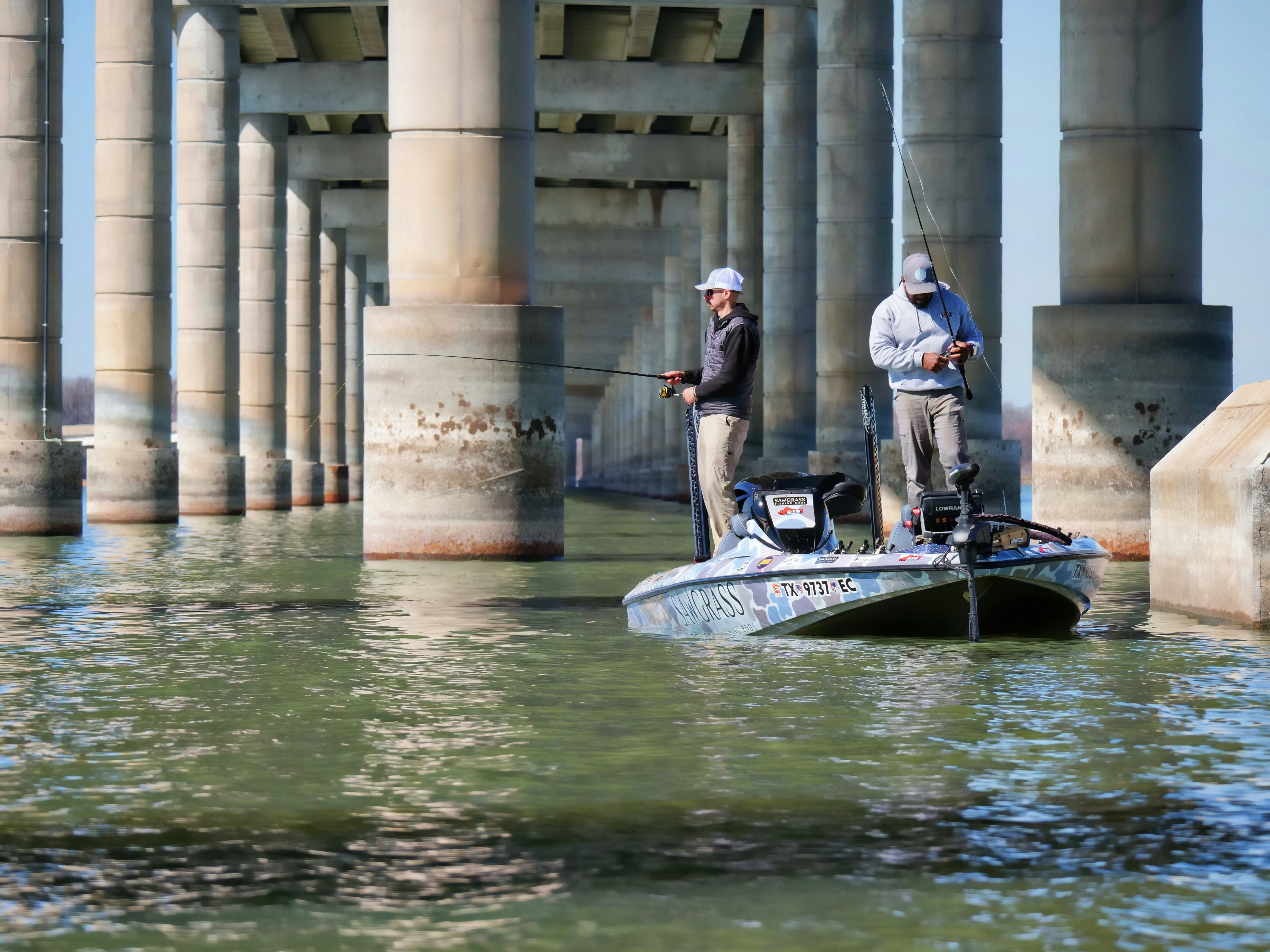 Under the Pier: Anglers at Rest in Quiet Tide