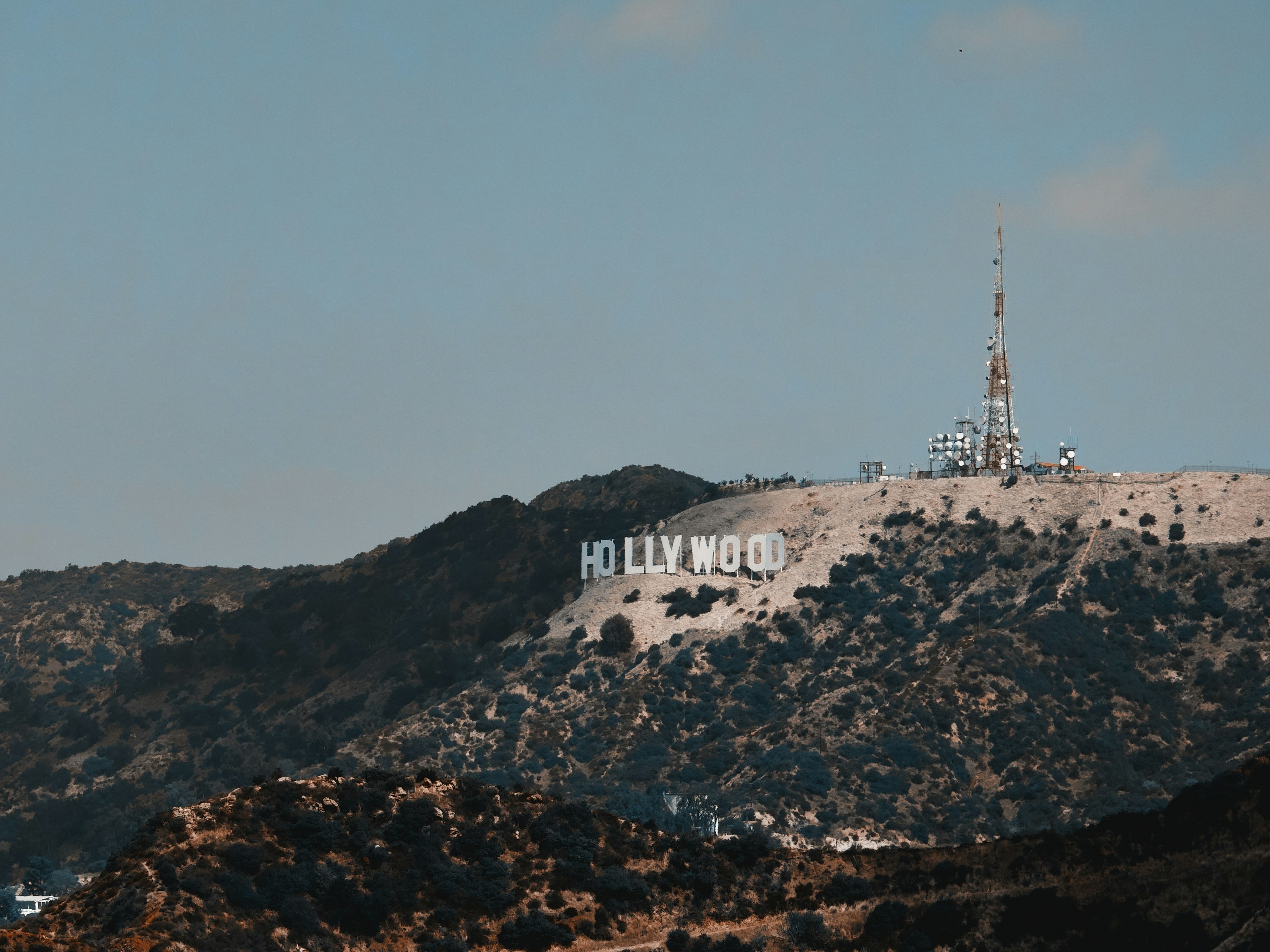 Hollywood Sign at Dawn: Hillside silhouette beneath a clear sky