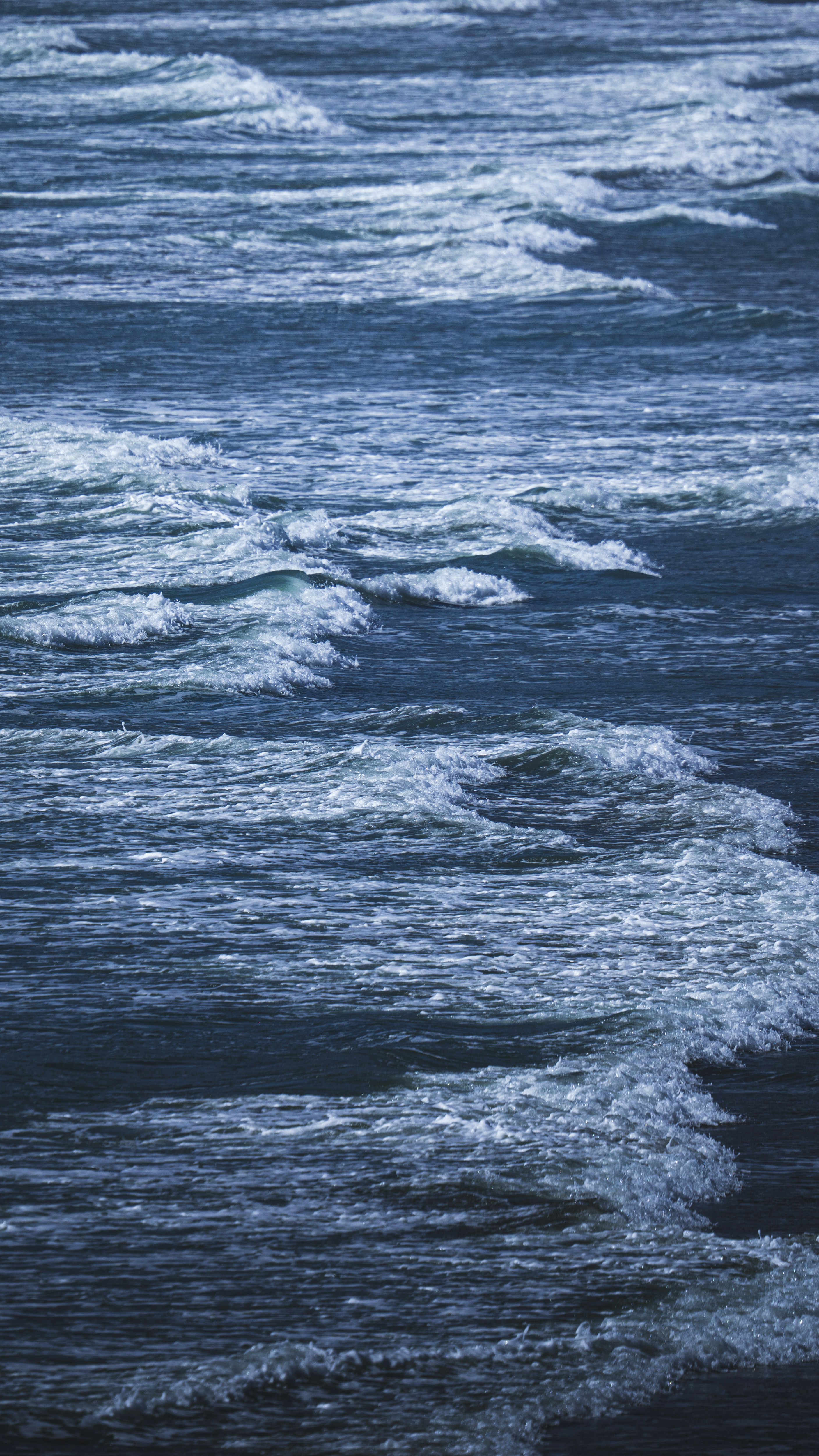 Rushing Ocean Ridges: A Blue-Pressed Sea in Motion