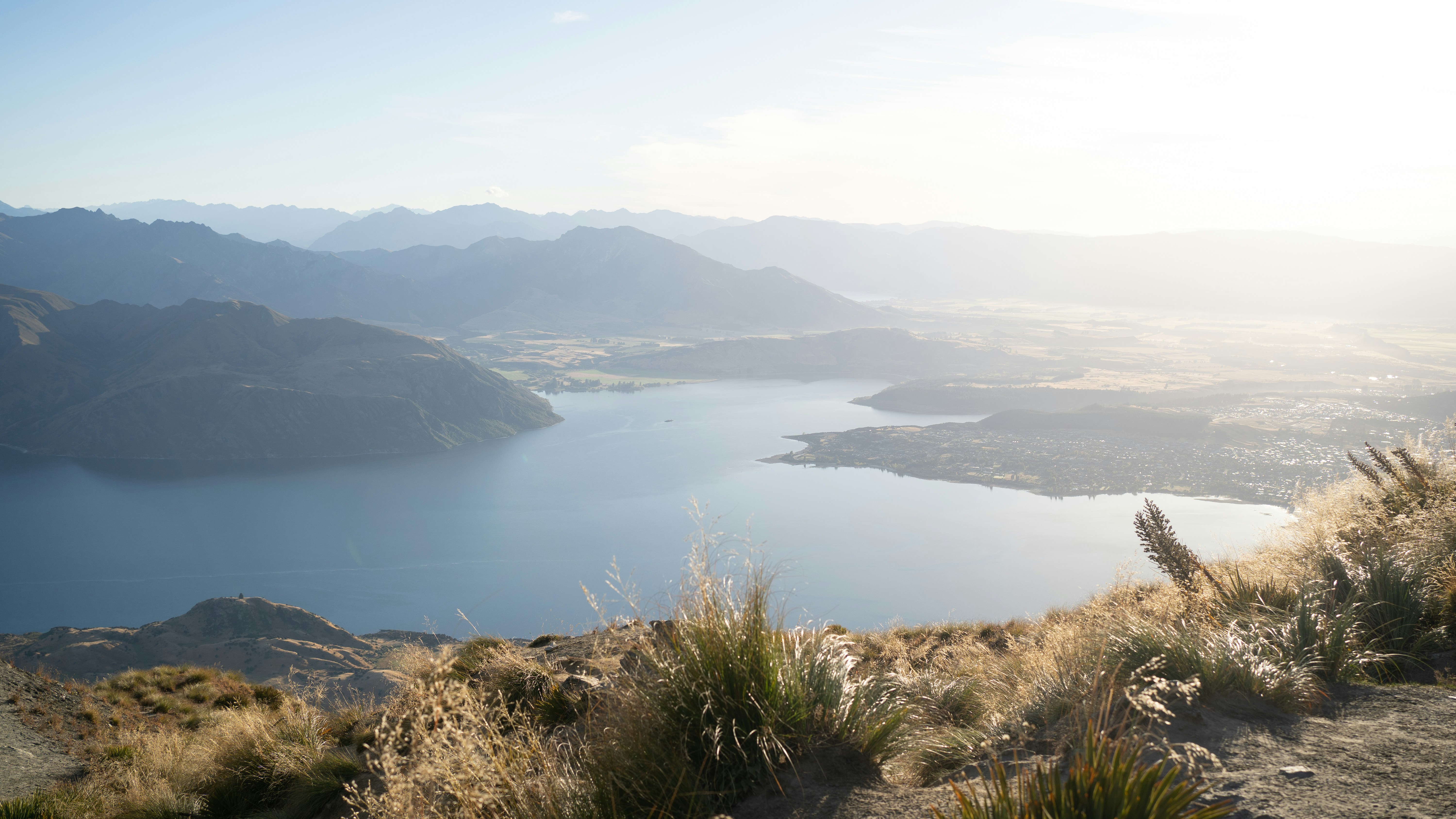 Overlook Above a Serene Reservoir: Golden Scrub and Distant Mountains