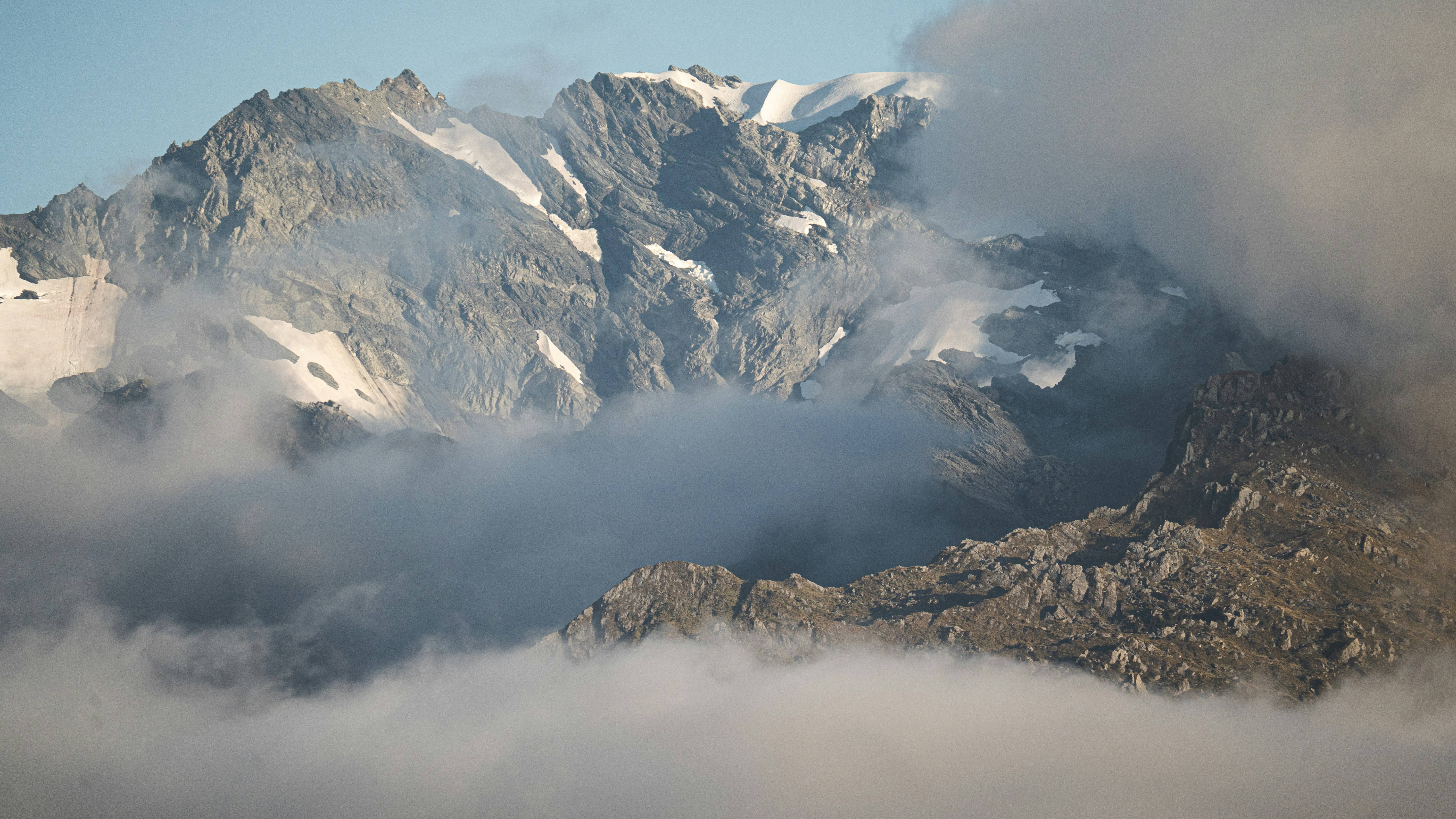 Summit Veil Over Misty Peaks