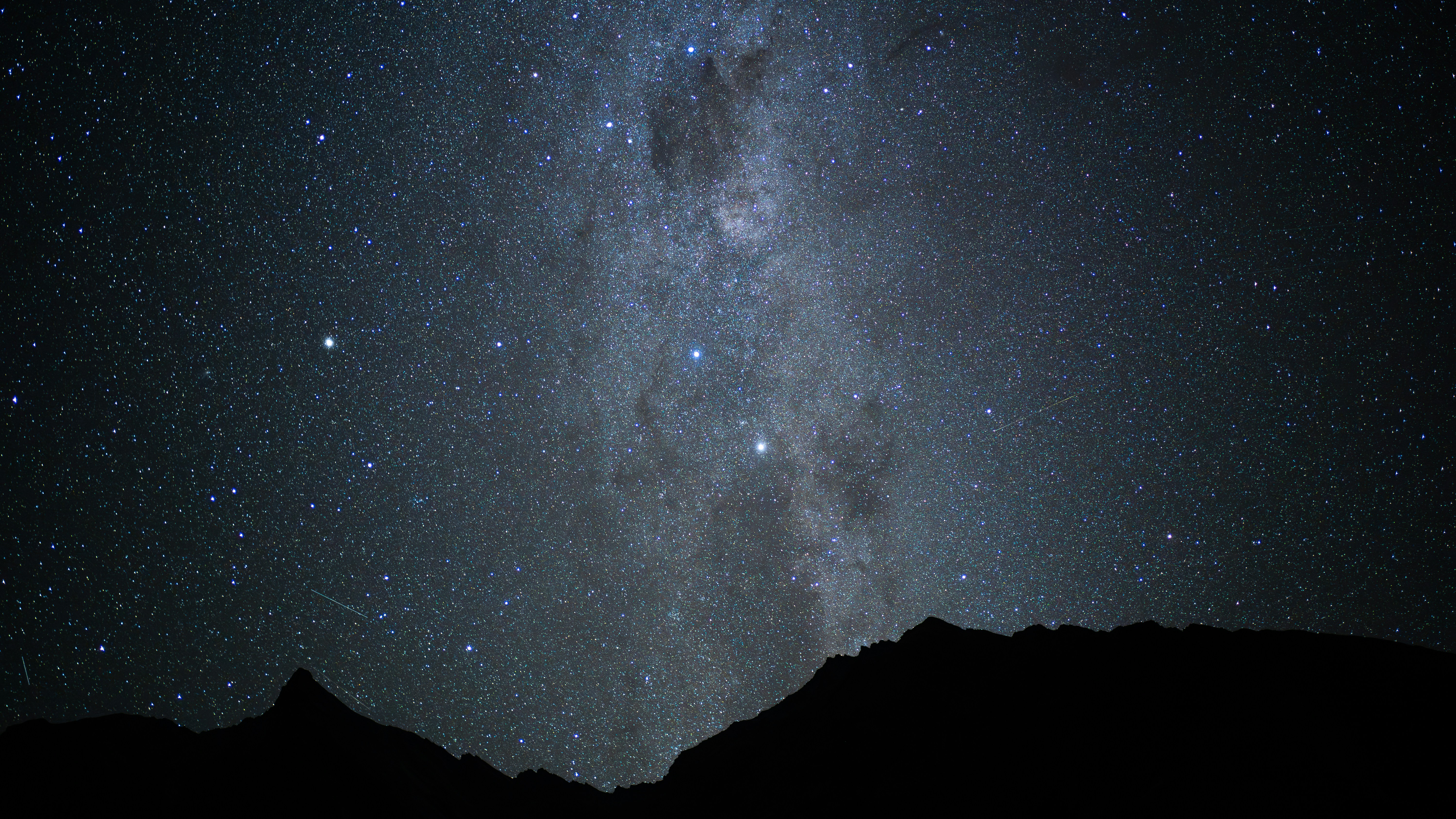 Milky Way Pierces a Silent Mountain Horizon