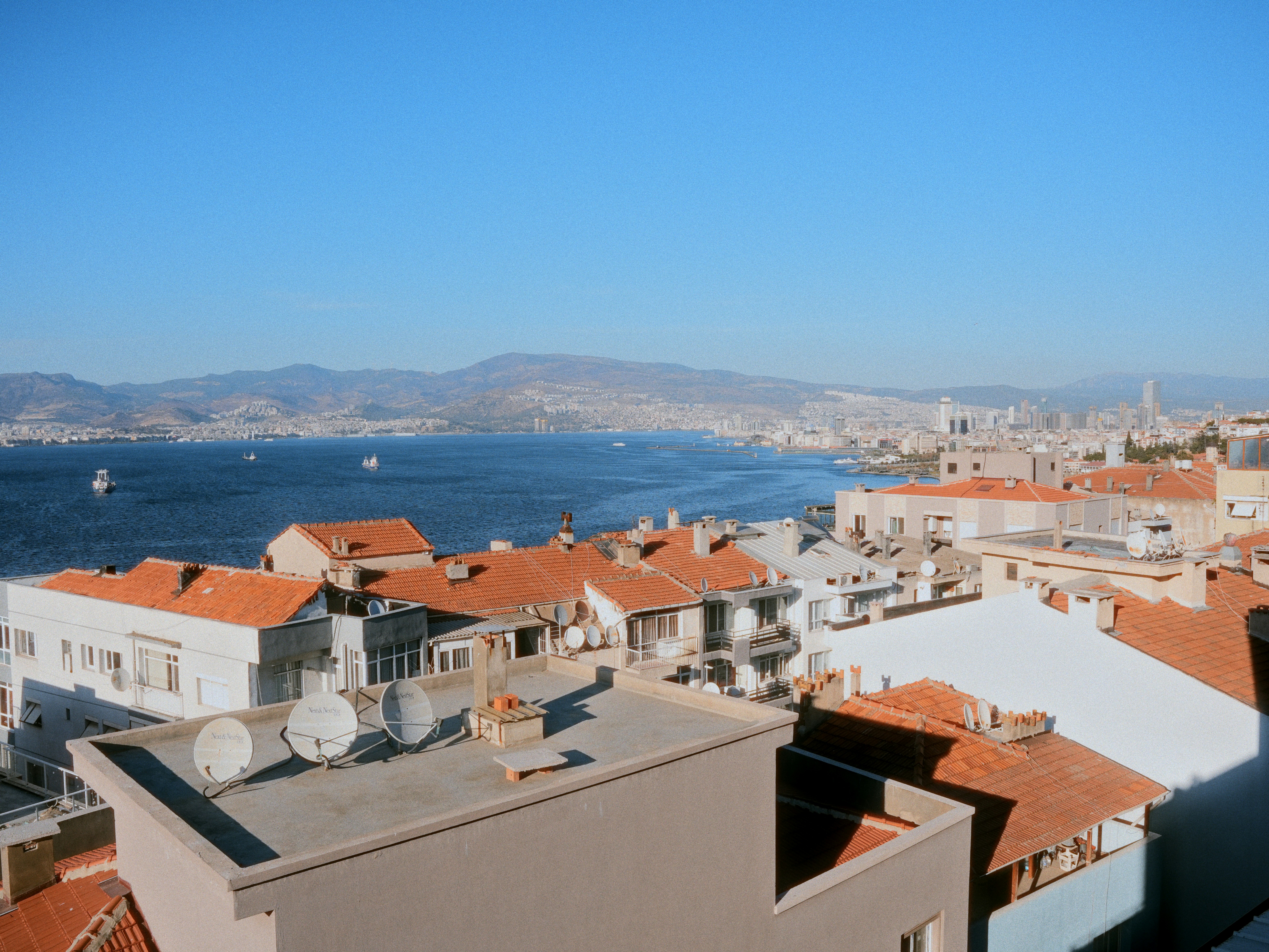 Terracotta Rooftops Curl into a Serene Seascape