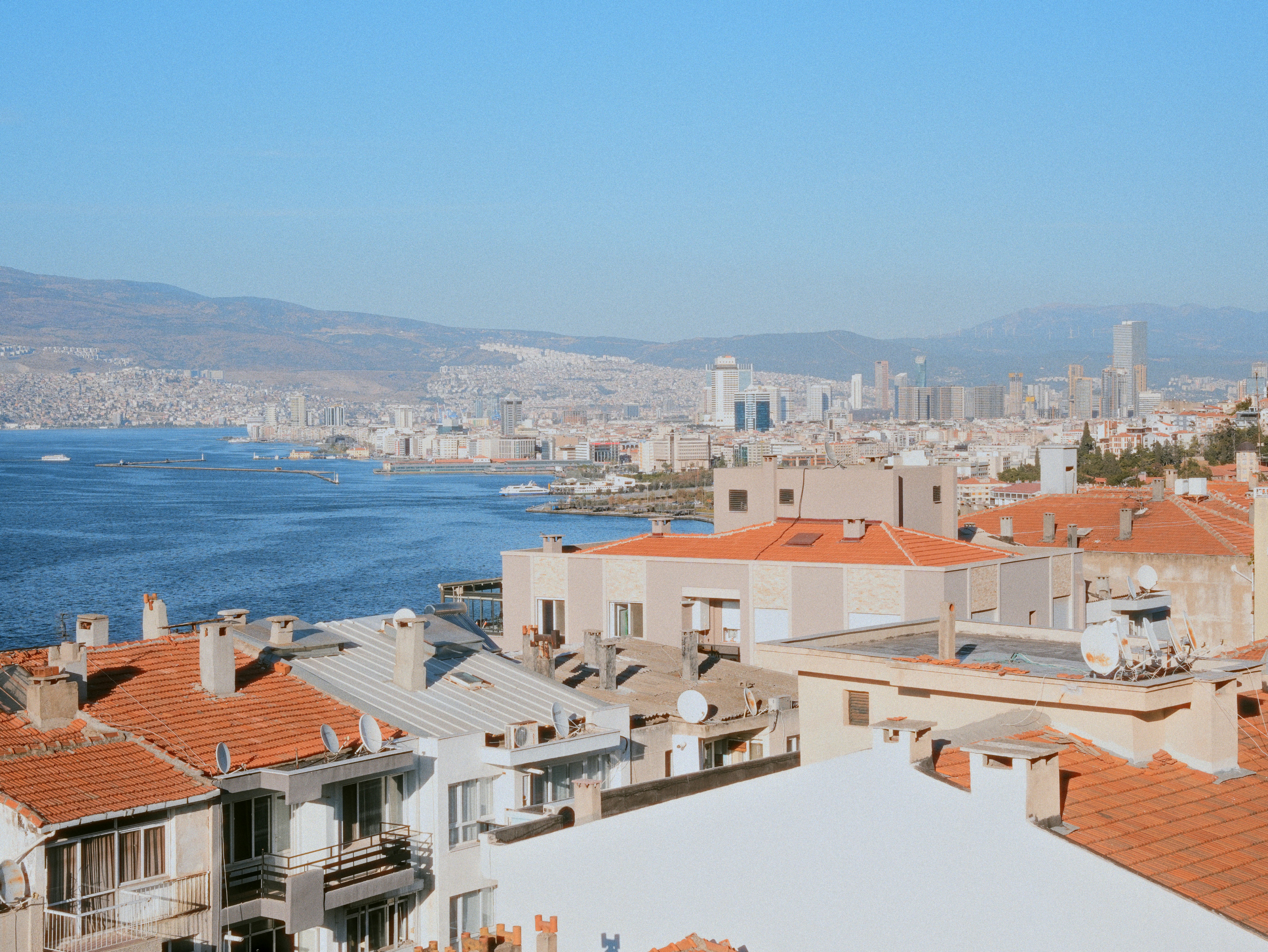 Terracotta Rooftops Meet the Sea: A Coastal Cityscape