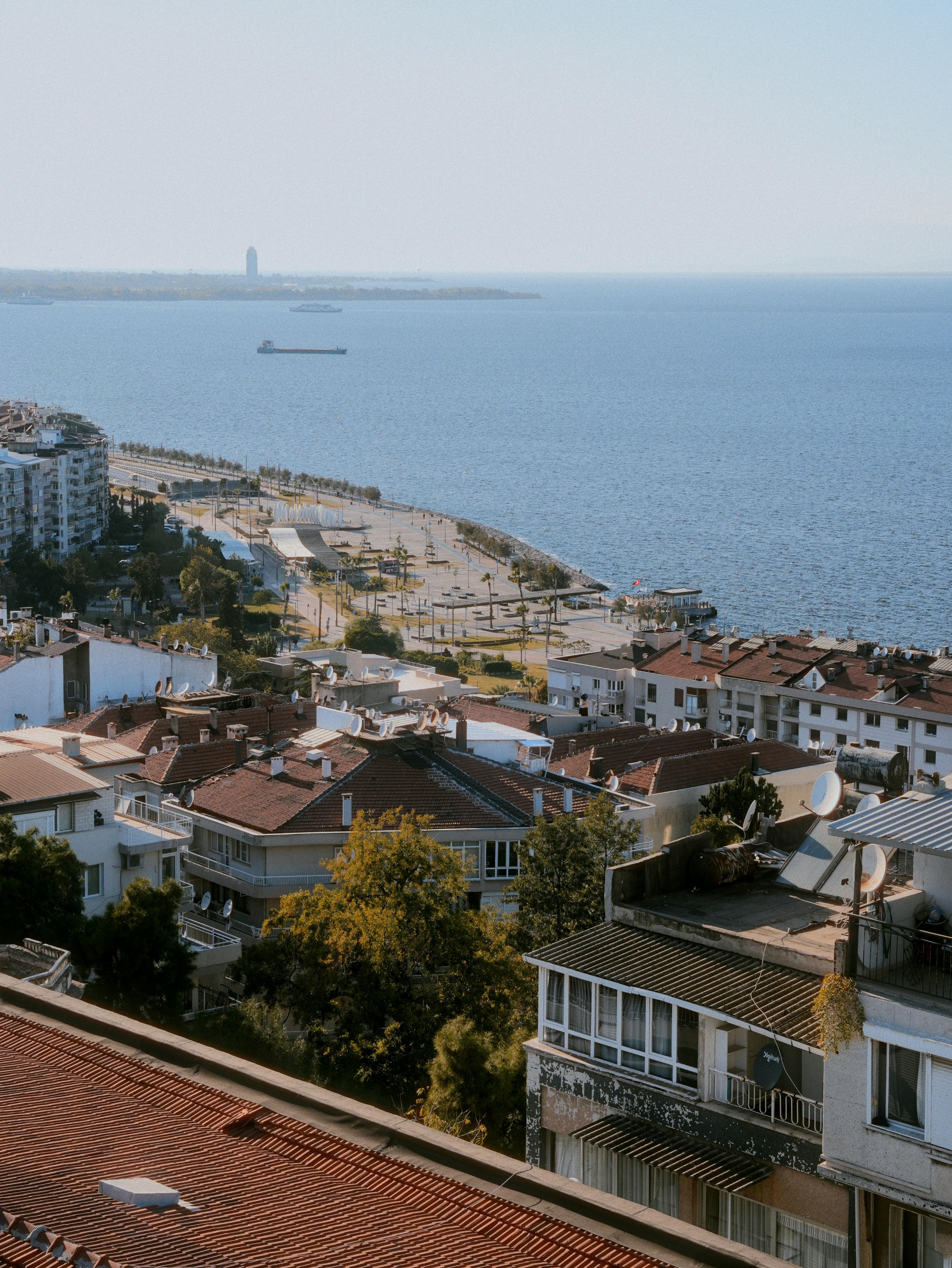 Coastal Terrace: Sunlit rooftops Overlooking the Sea