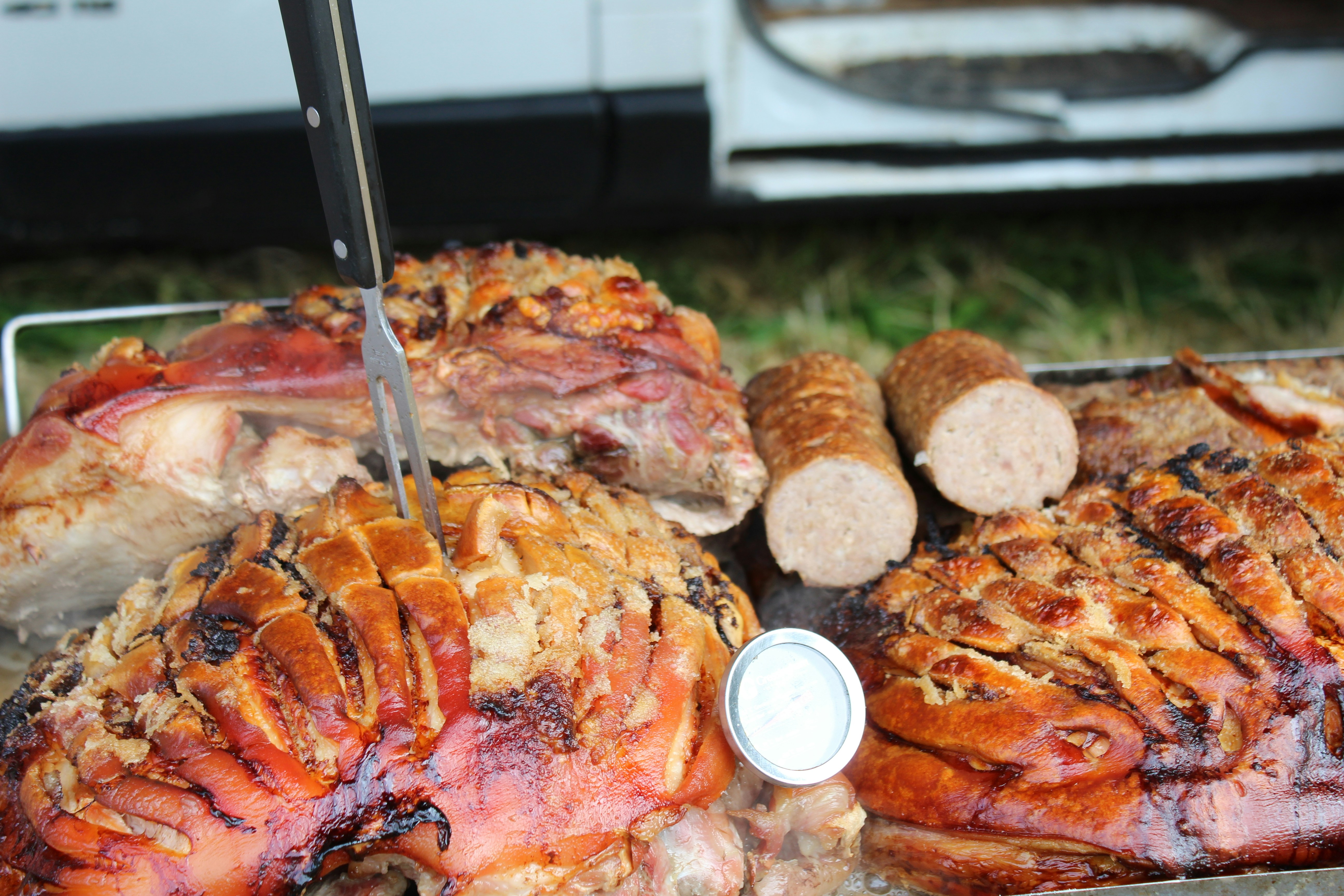 Charred Christmas Roast: knife poised over succulent smoked meat