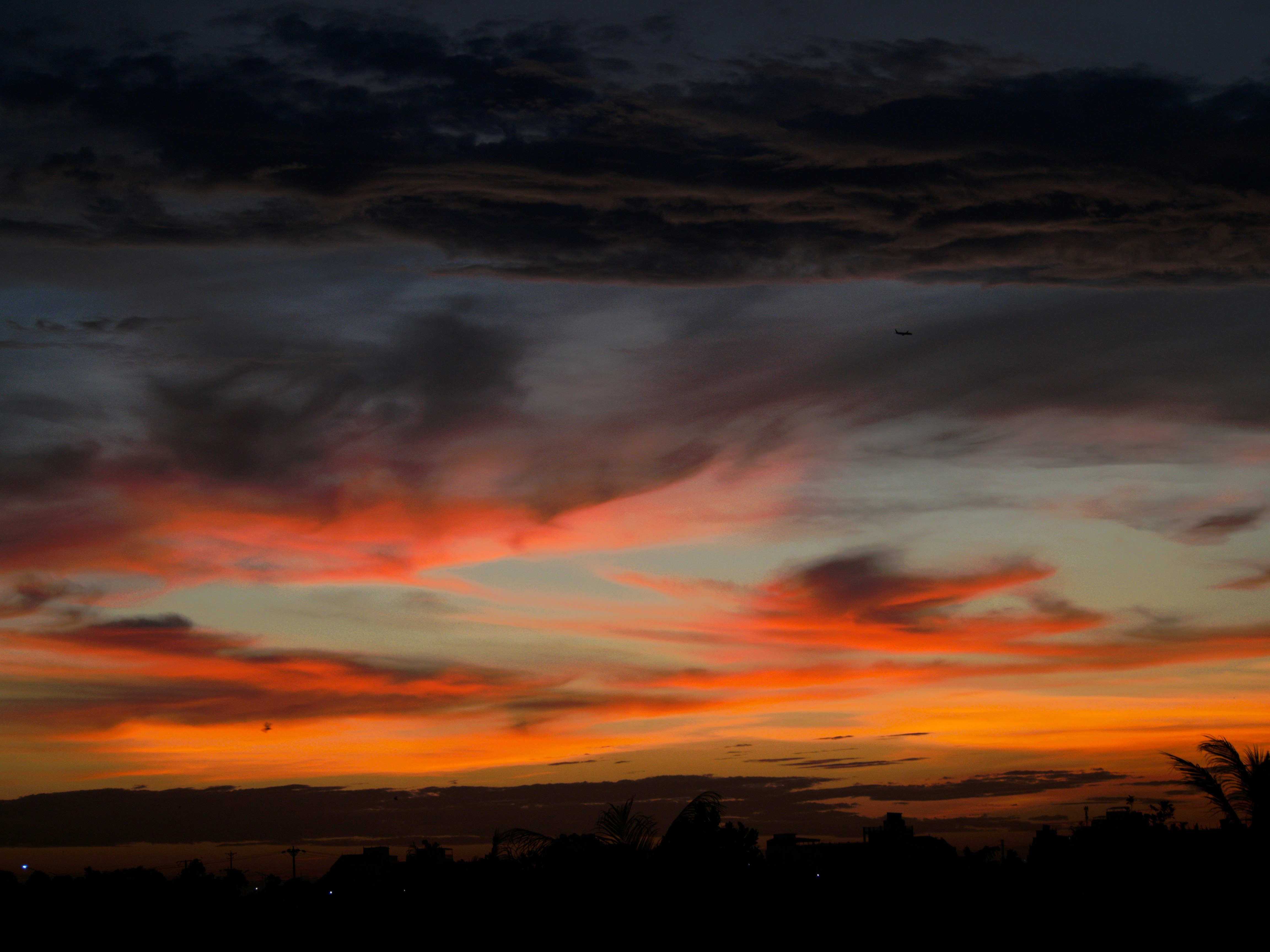 Last Light over the Horizon: Silhouettes Beneath a Fiery Sky
