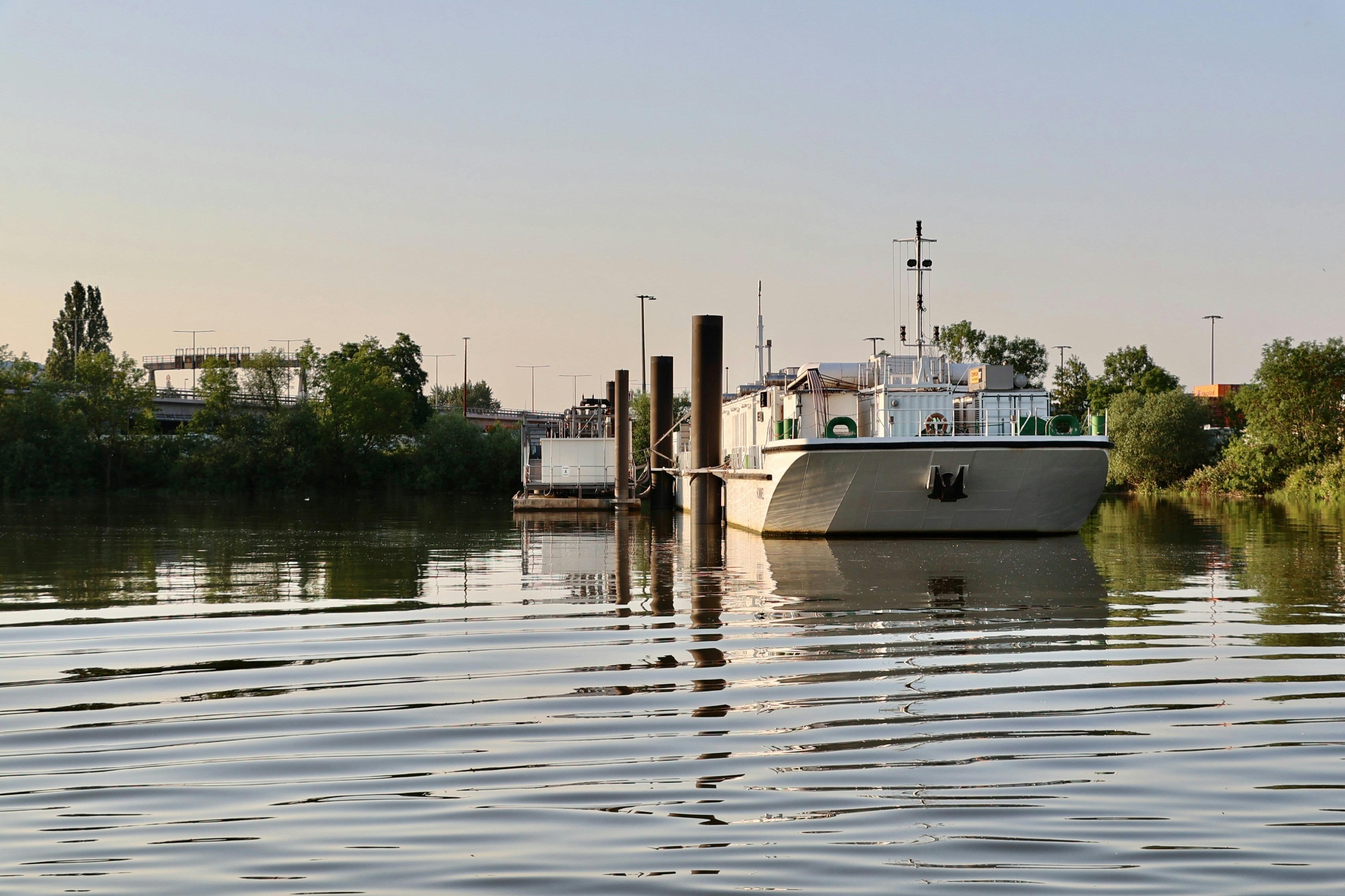 Harbor Vessel at Dusk: A Quiet Riverfront Encounter