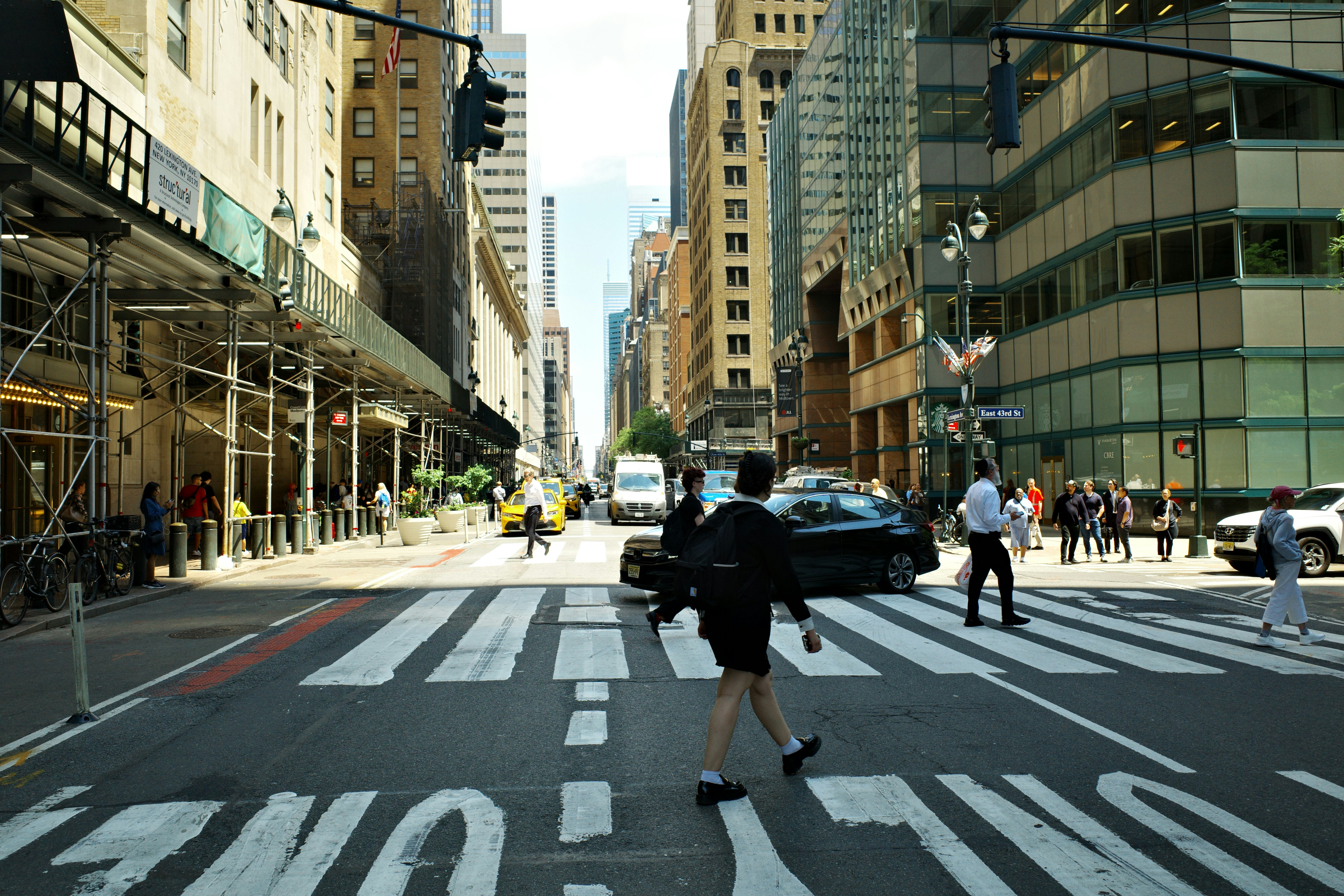 Crosswalk Convergence: City Pulse at Midday