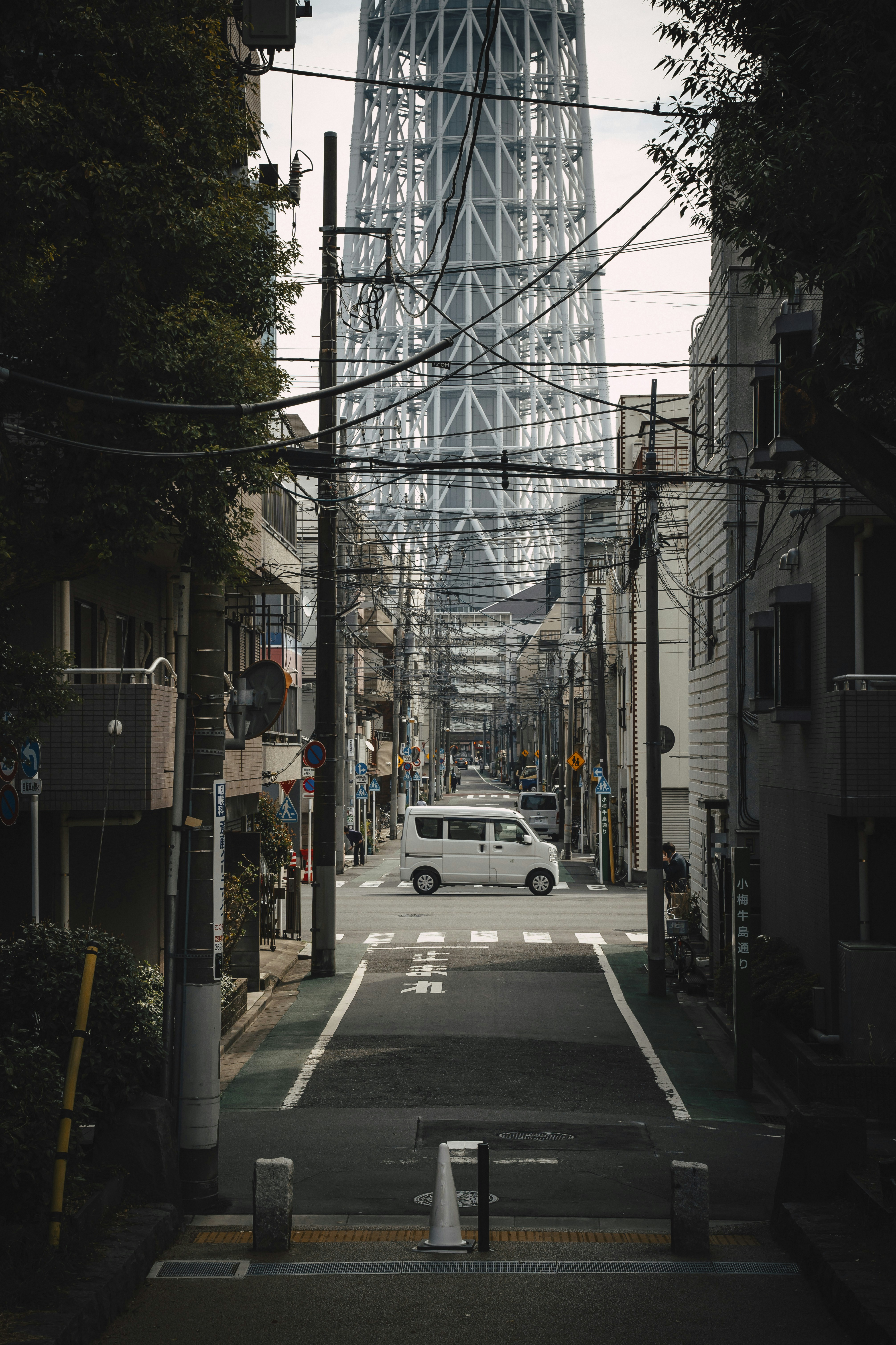 Urban Arc: A Narrow Street Toward a Metallic Tower