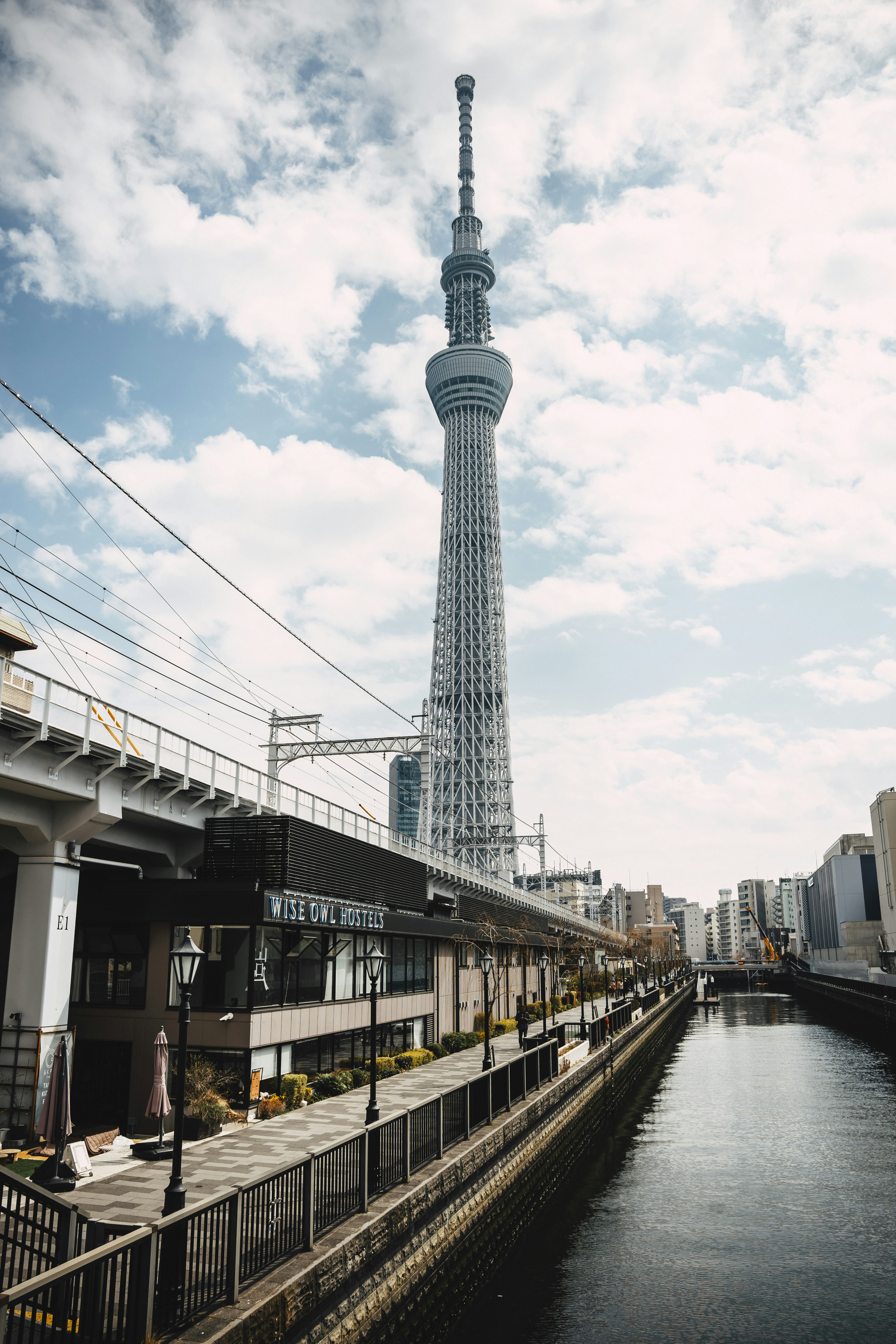 Tokyo Tower Rising Over the Canal and Boardwalk