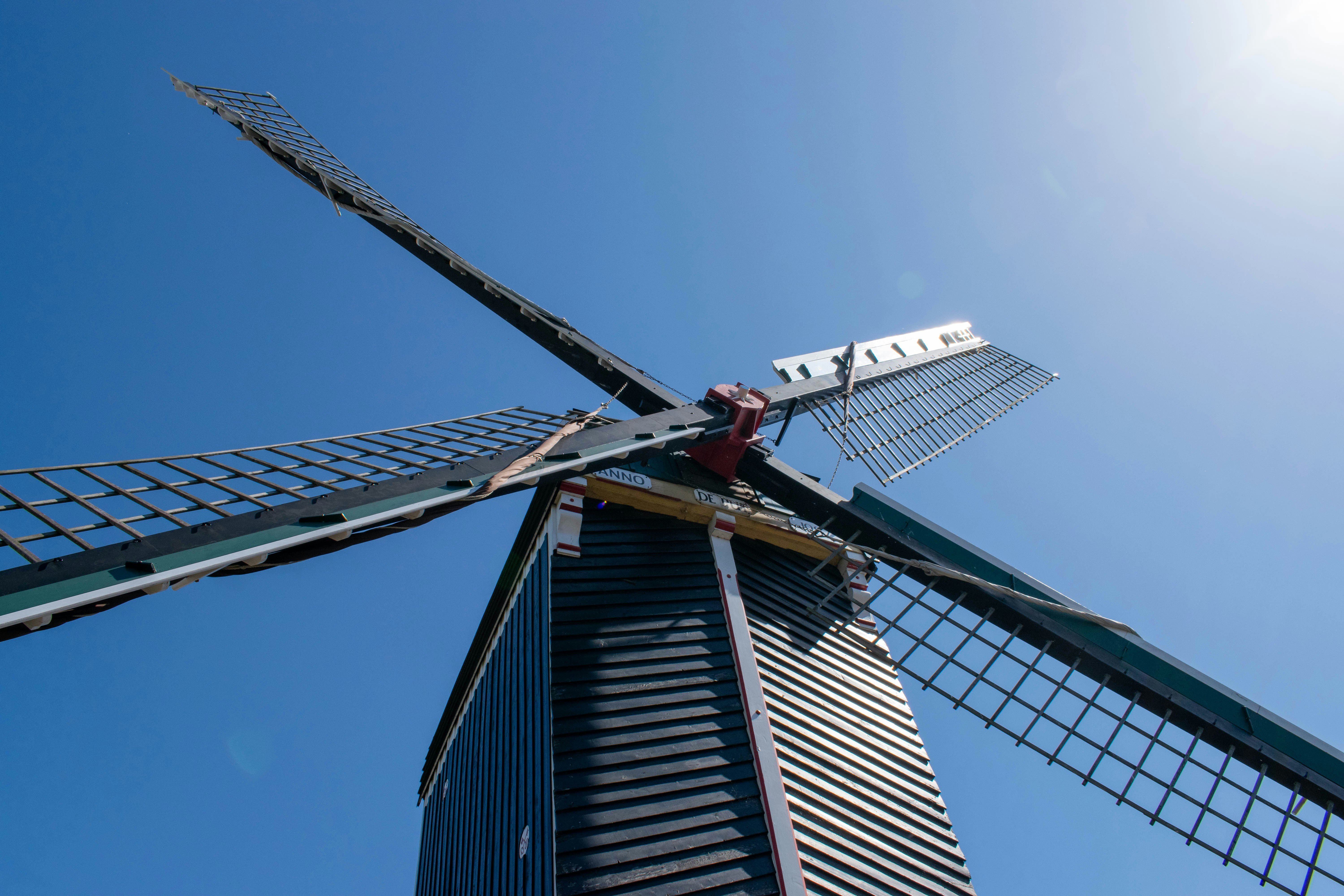 Blue Sky Tower: A Low-Angle Look Up at the Windmill Spokes