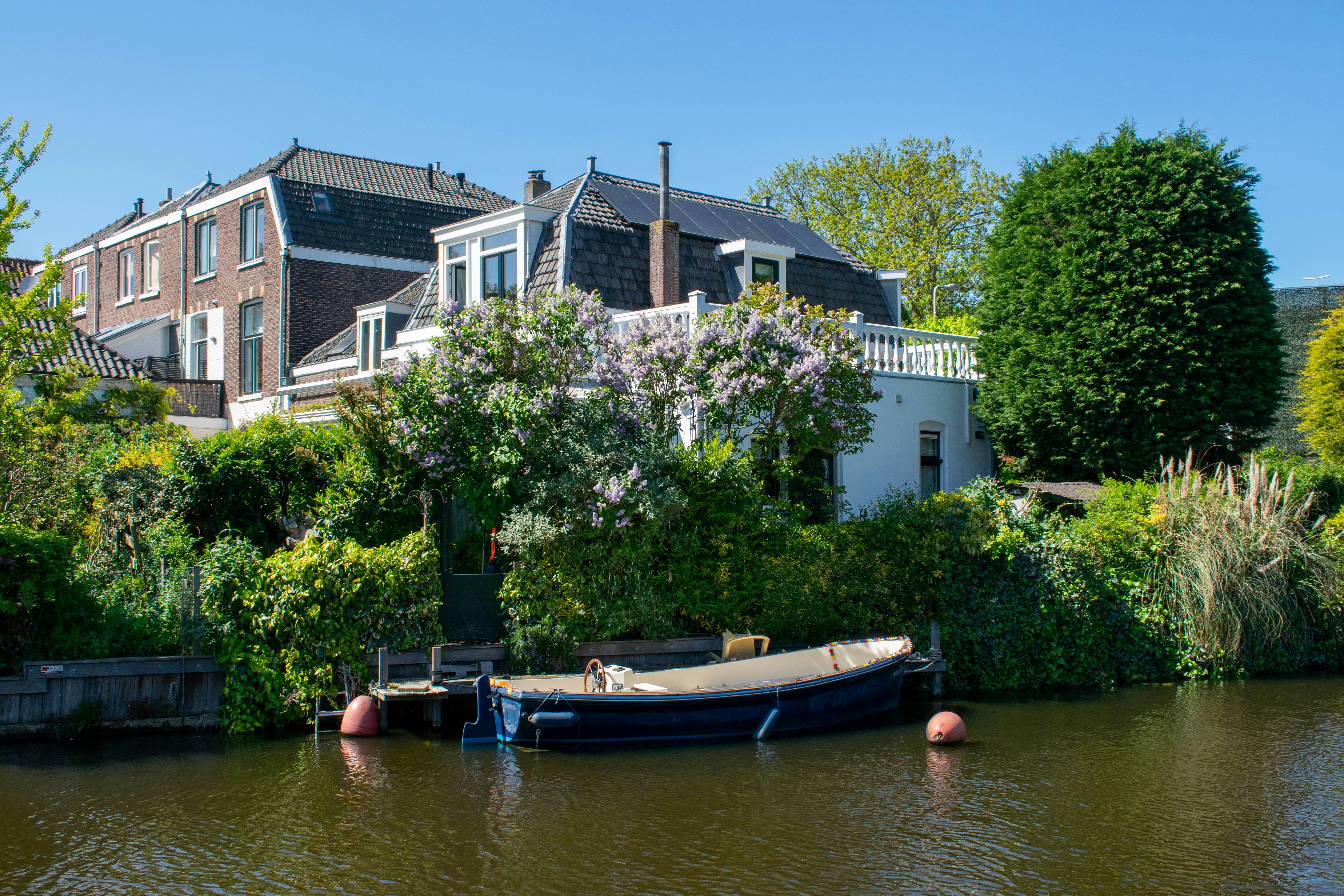 Whispering Canal: Housefronts and a Lulled Boat